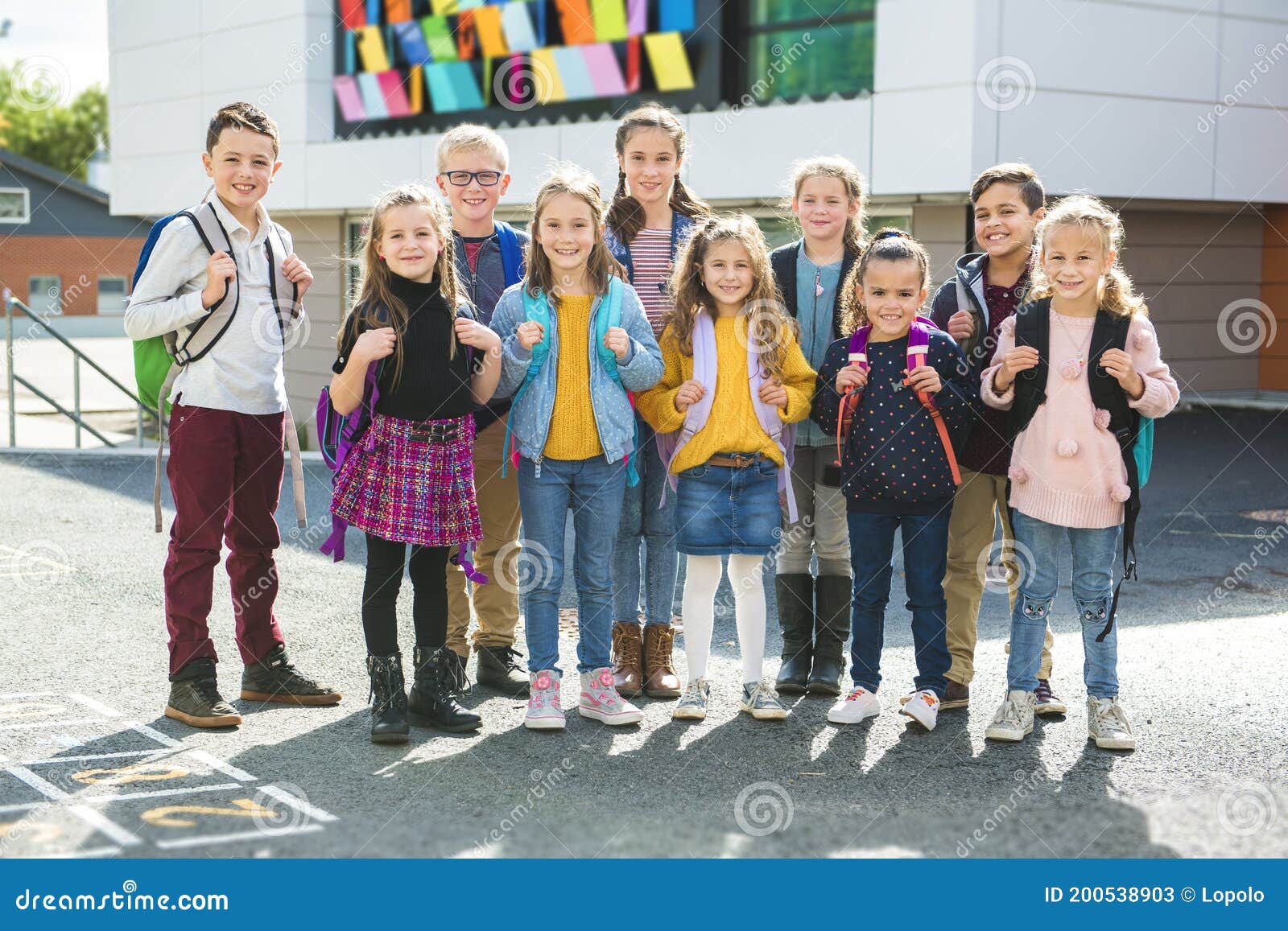 Group of Kids on the School Background Having Fun Stock Image - Image ...