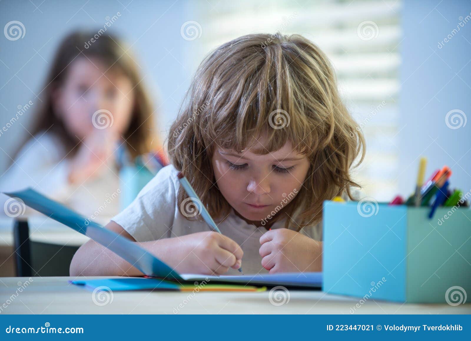 Kids at School. School Child Writing Something in Copybook and Sitting ...