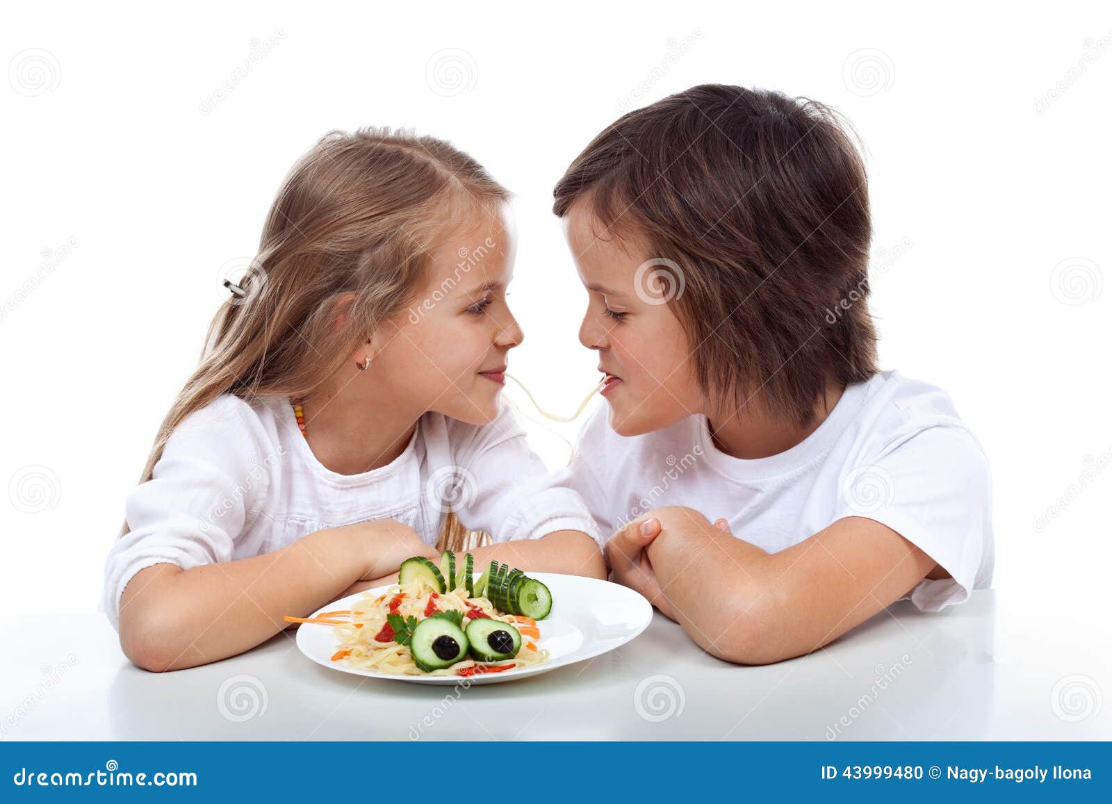 Kids Sipping on the Same String of Pasta Stock Photo - Image of ...