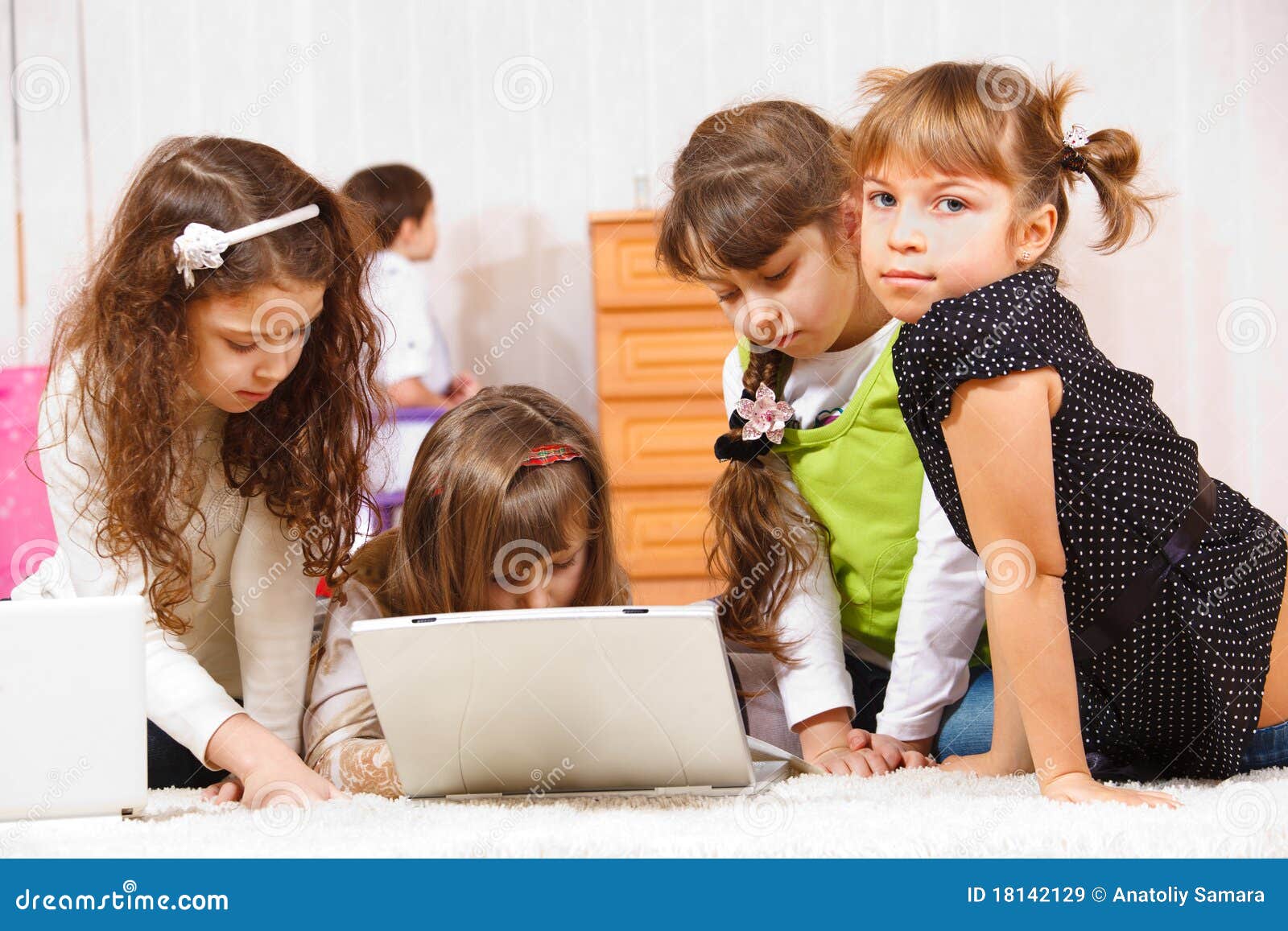 Kids sit around laptop stock image. Image of curious - 18142129