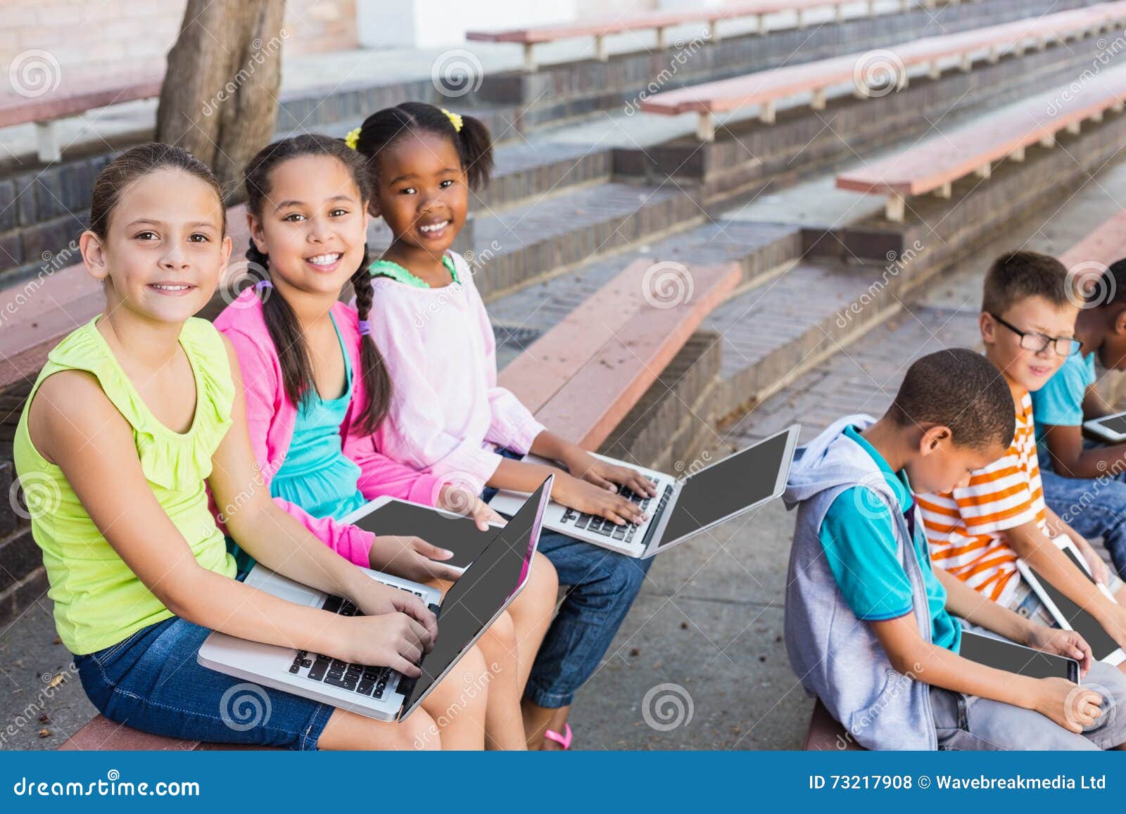 Kids Sitting on Bench and Using Laptop Stock Photo - Image of child ...