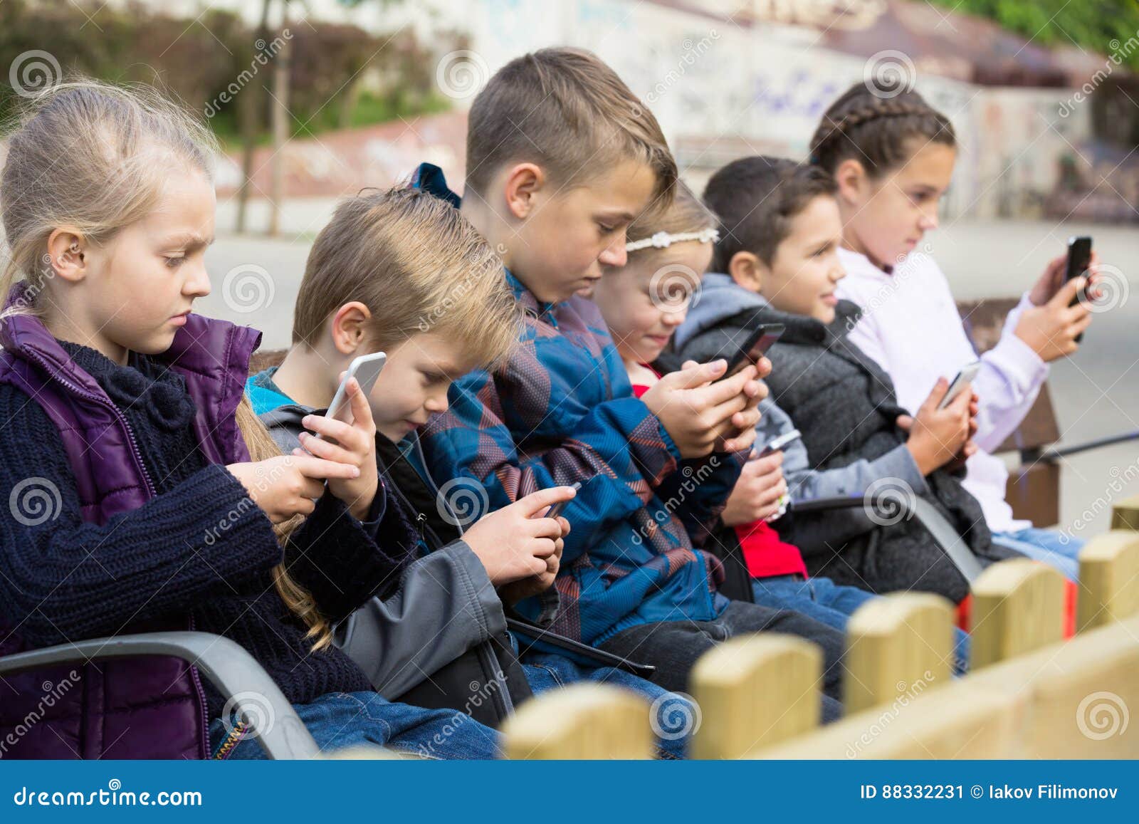 Kids Sitting with Mobile Devices Stock Image - Image of leisure ...