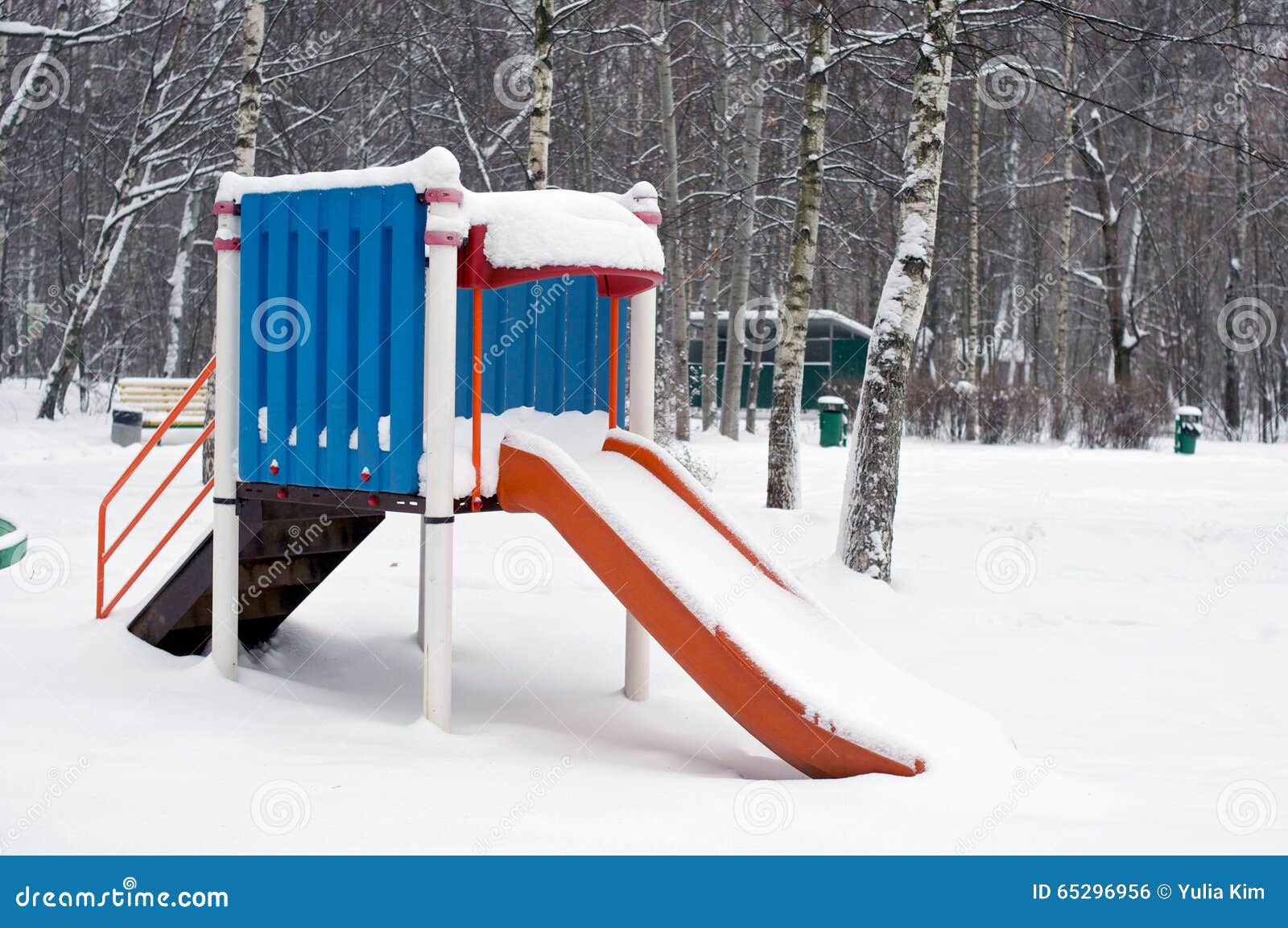 Kids slide in winter front stock photo. Image of snowfall - 65296956
