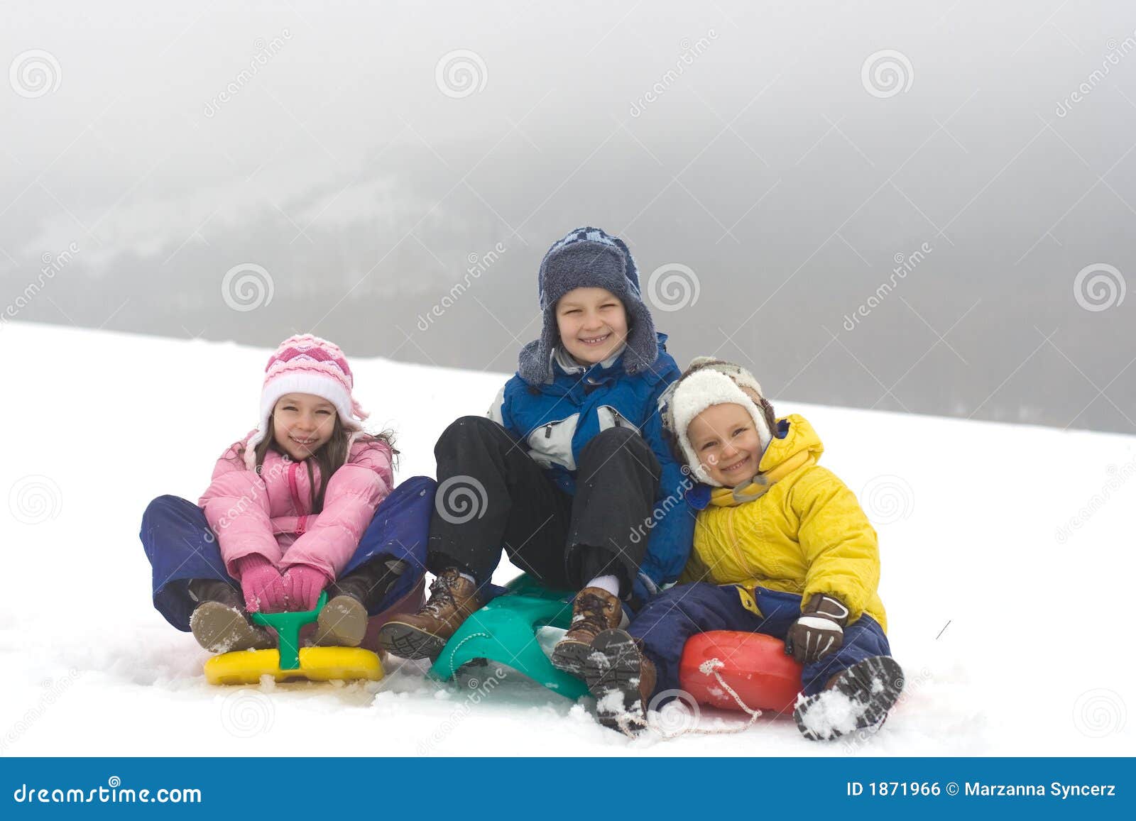 Kids Sliding on Fresh Snow stock photo. Image of freezing - 1871966