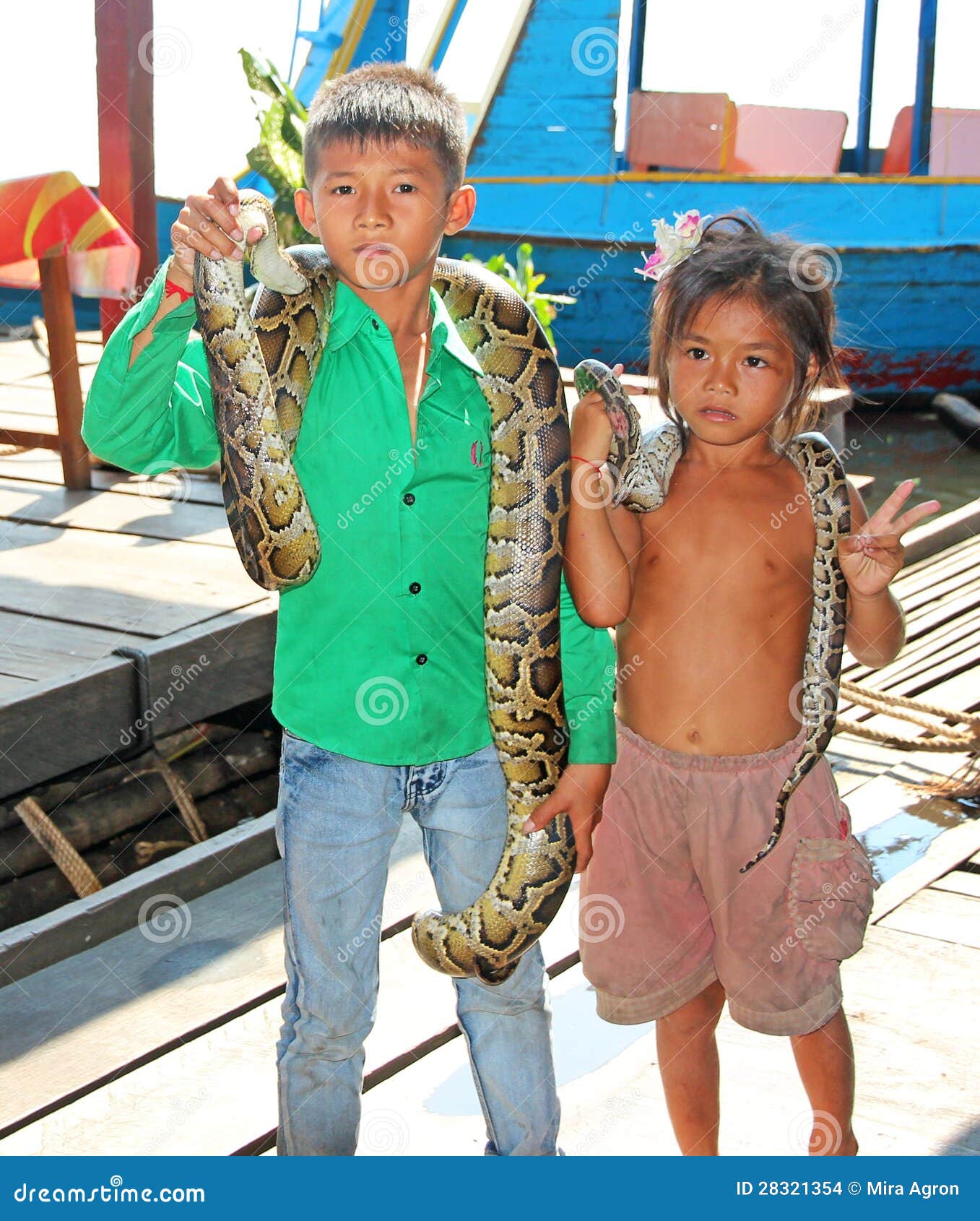 Kids with Snake editorial stock image. Image of money - 28321354