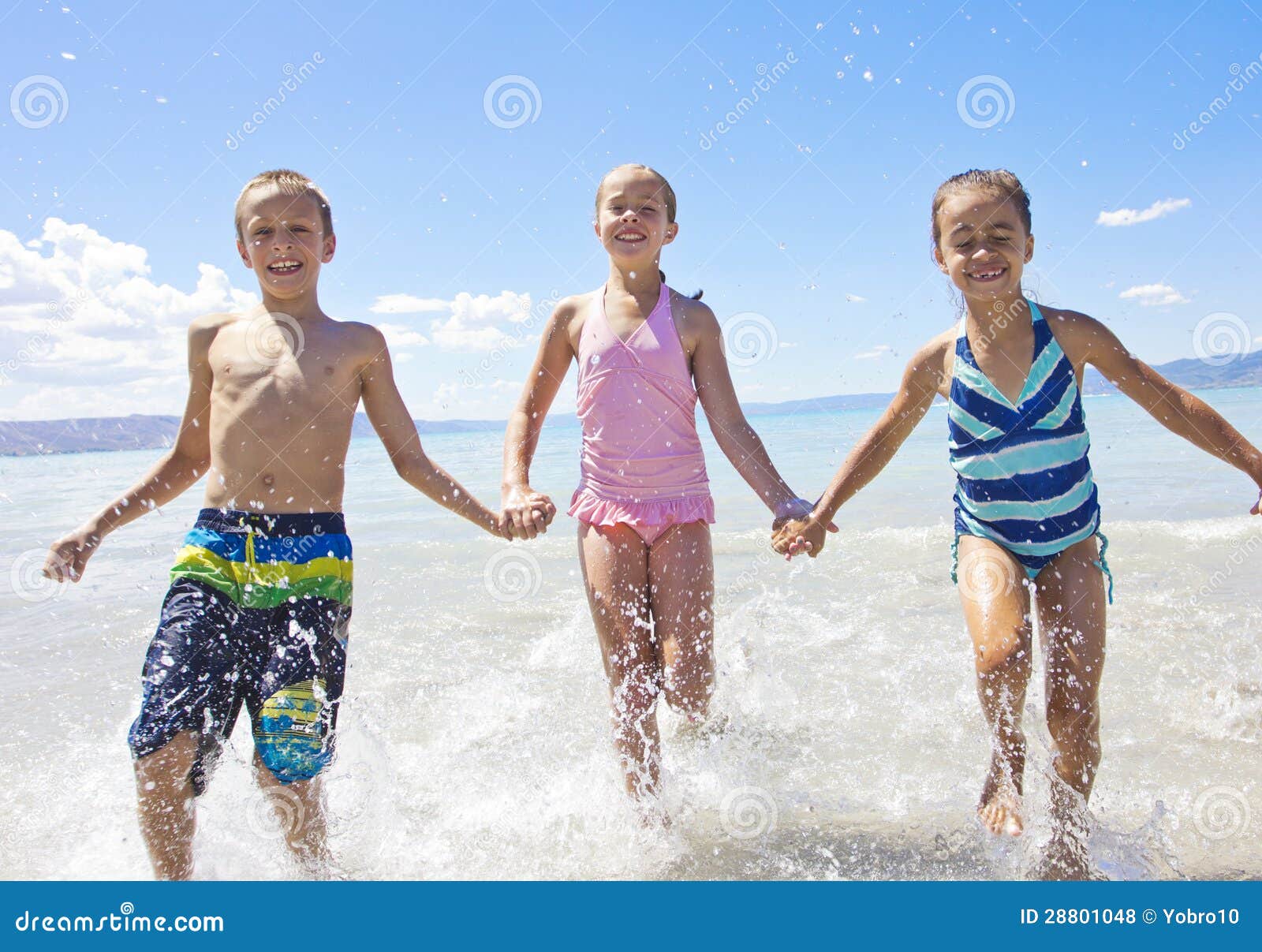 Kids Splashing and Playing in the Ocean Stock Photo - Image of ...