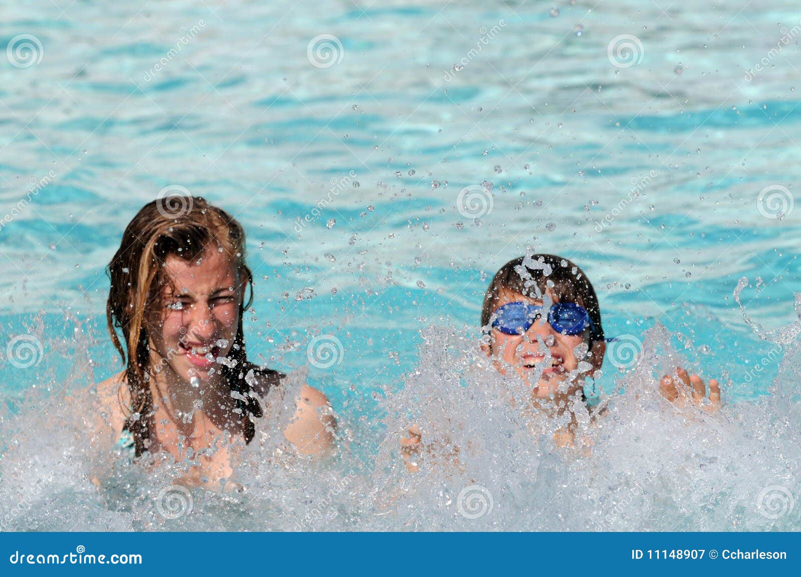 Kids Splashing in Swimming Pool Stock Image - Image of cool, goggles ...