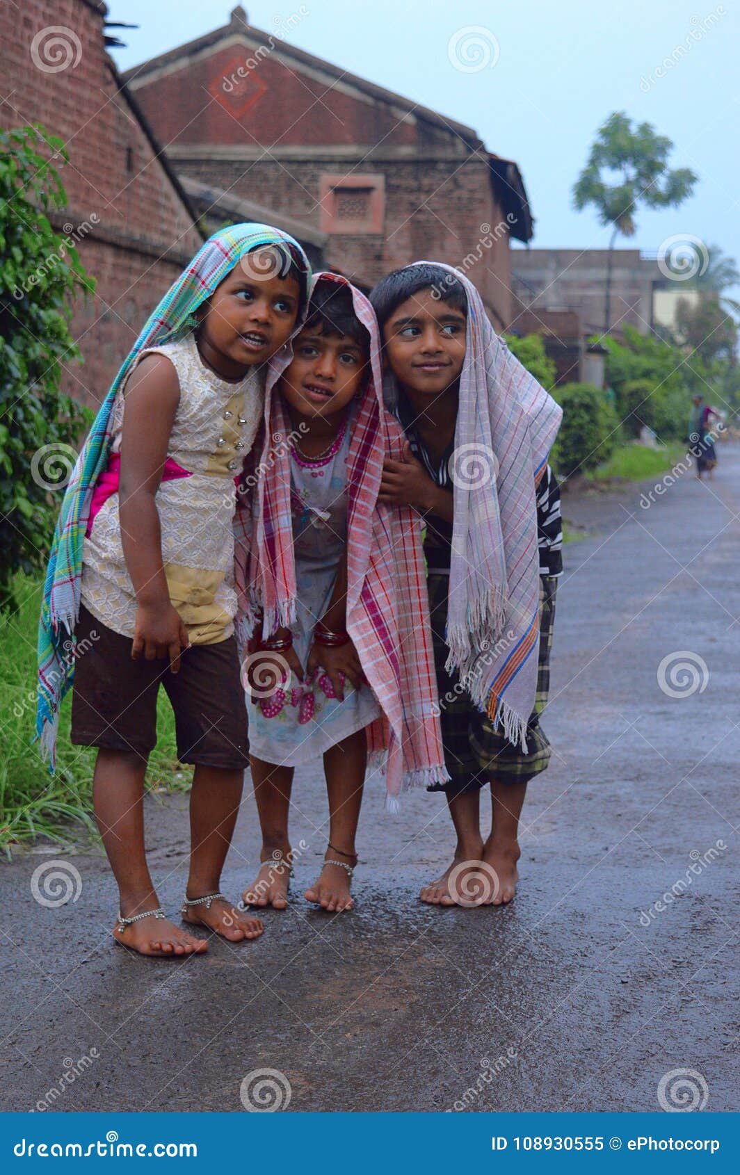 Kids Standing and Protecting Themselves from Rain Editorial Image ...