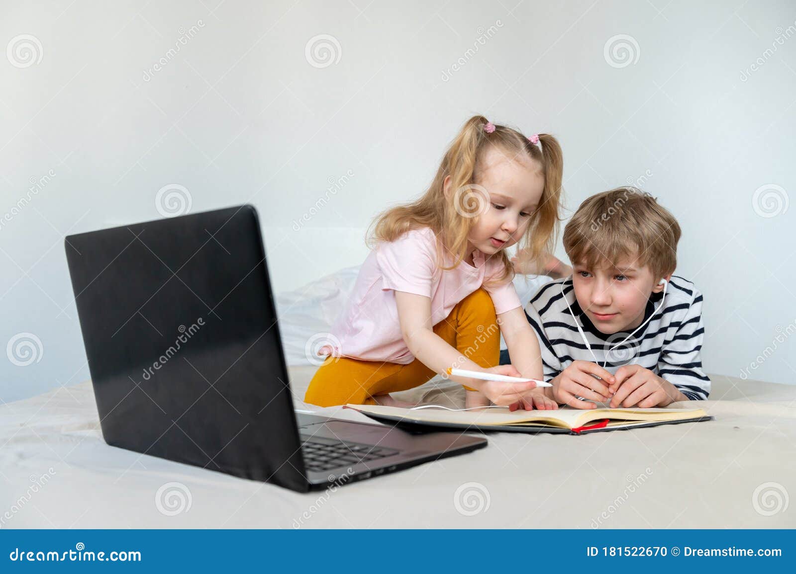 Kids Studying at Home Using Laptop and Book Stock Photo - Image of ...