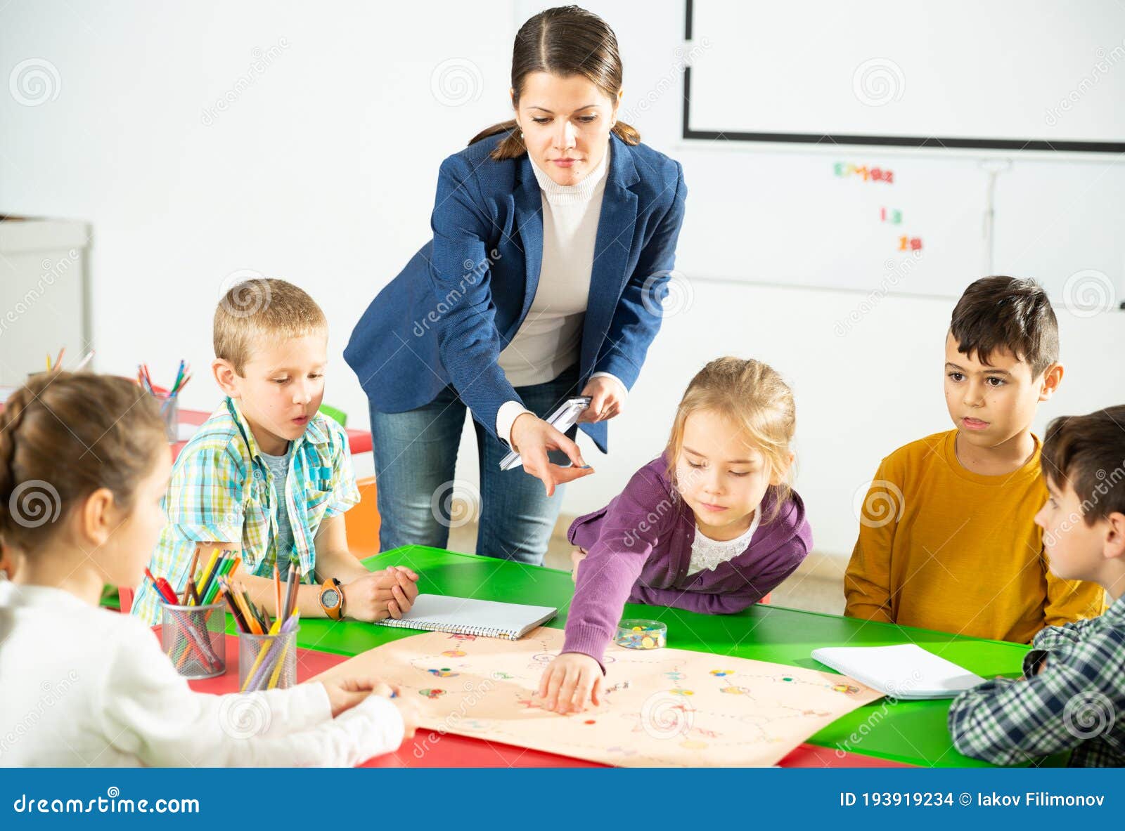 Kids with Teacher Playing Educational Tabletop Game Stock Photo - Image ... Kids with Teacher Playing Educational Tabletop Game Stock Photo - Image ...