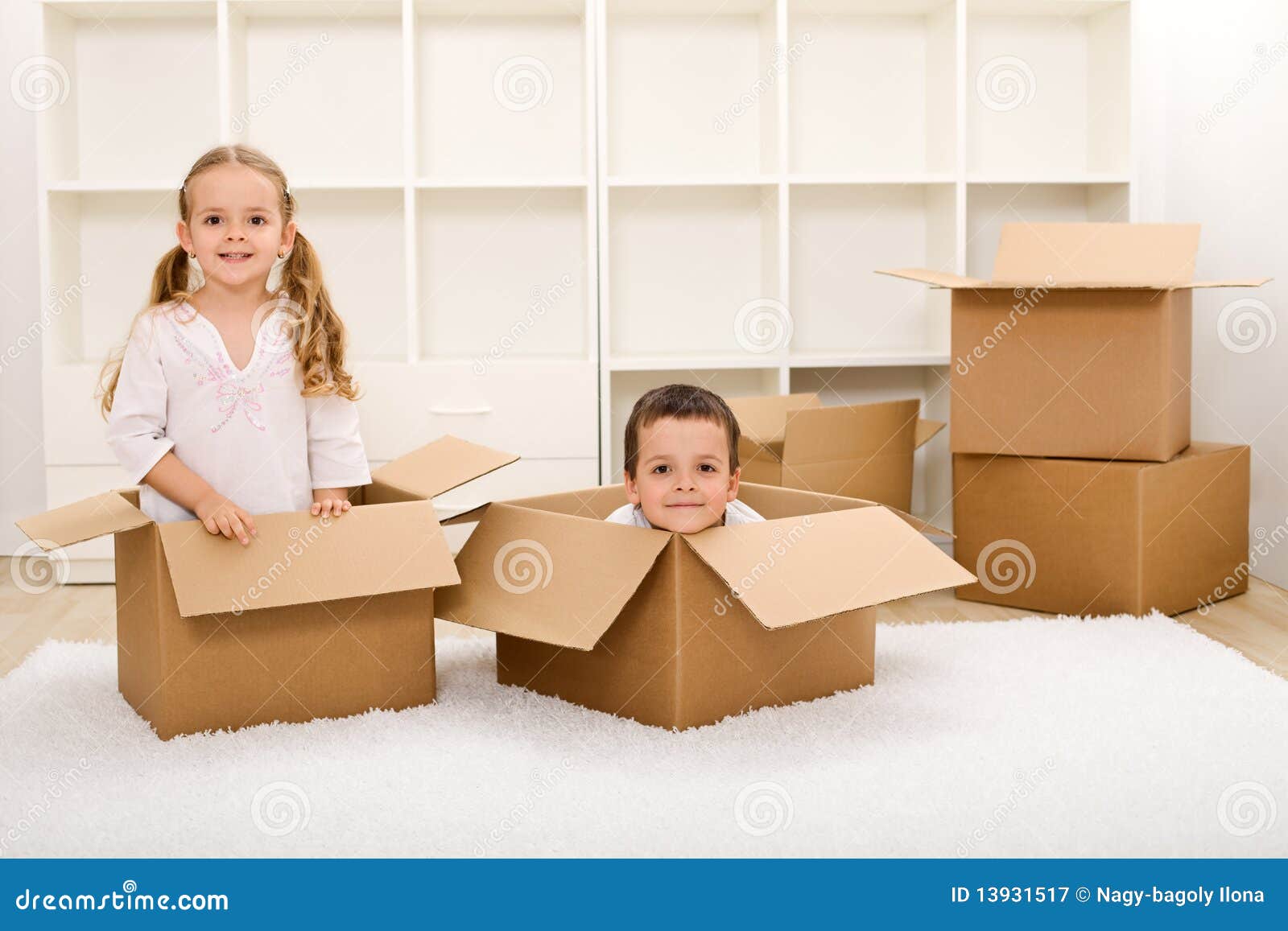 Kids in Their New Home with Boxes Stock Image - Image of closeup, home ...