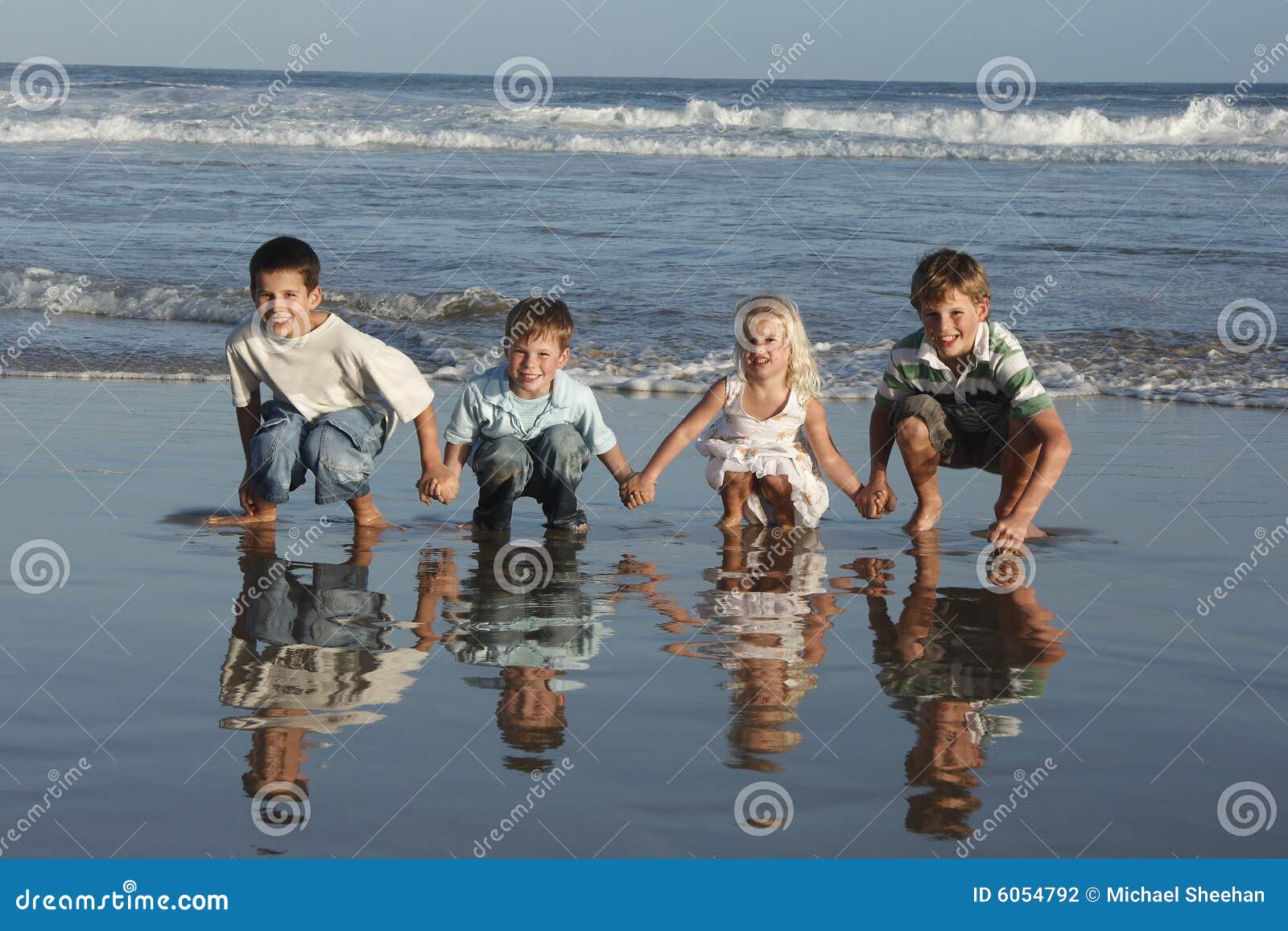 Kids about to jump stock photo. Image of happiness, island - 6054792