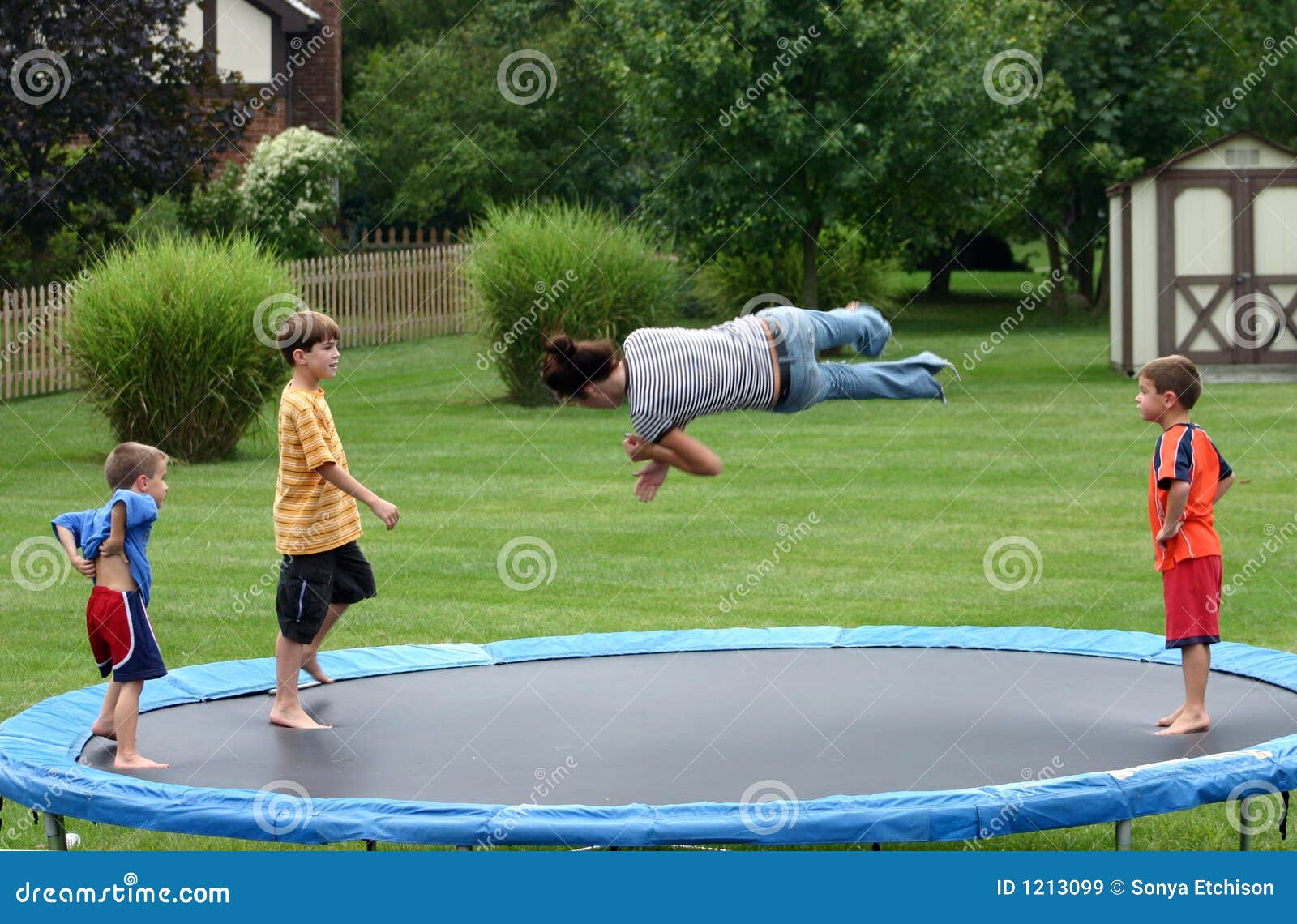 Kids on Trampoline stock image. Image of four, face, jumping - 1213099