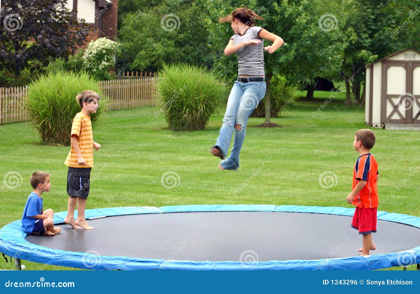 Kids on Trampoline stock photo. Image of green, boys, kids - 1243296