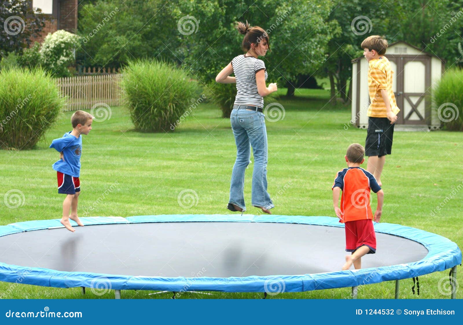 Kids on Trampoline stock photo. Image of kids, outdoor - 1244532