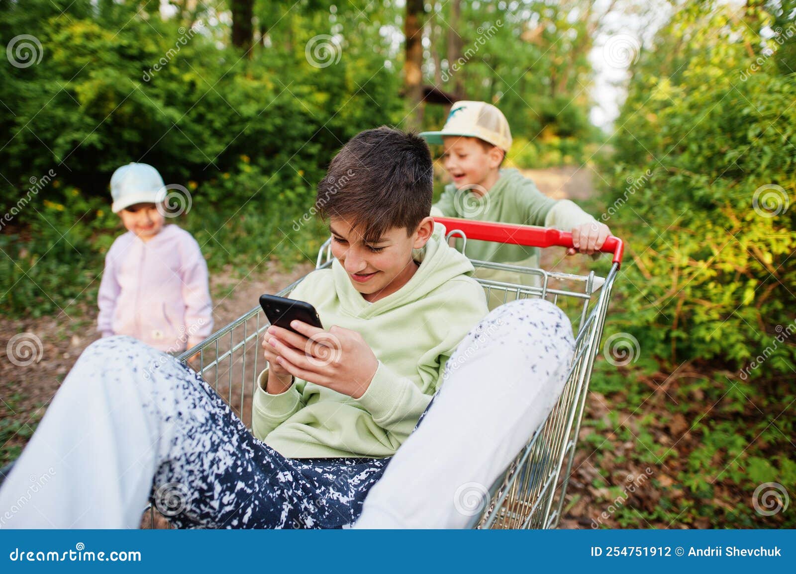 Kids with Trolley Having Fun in Forest Stock Photo - Image of childhood ...