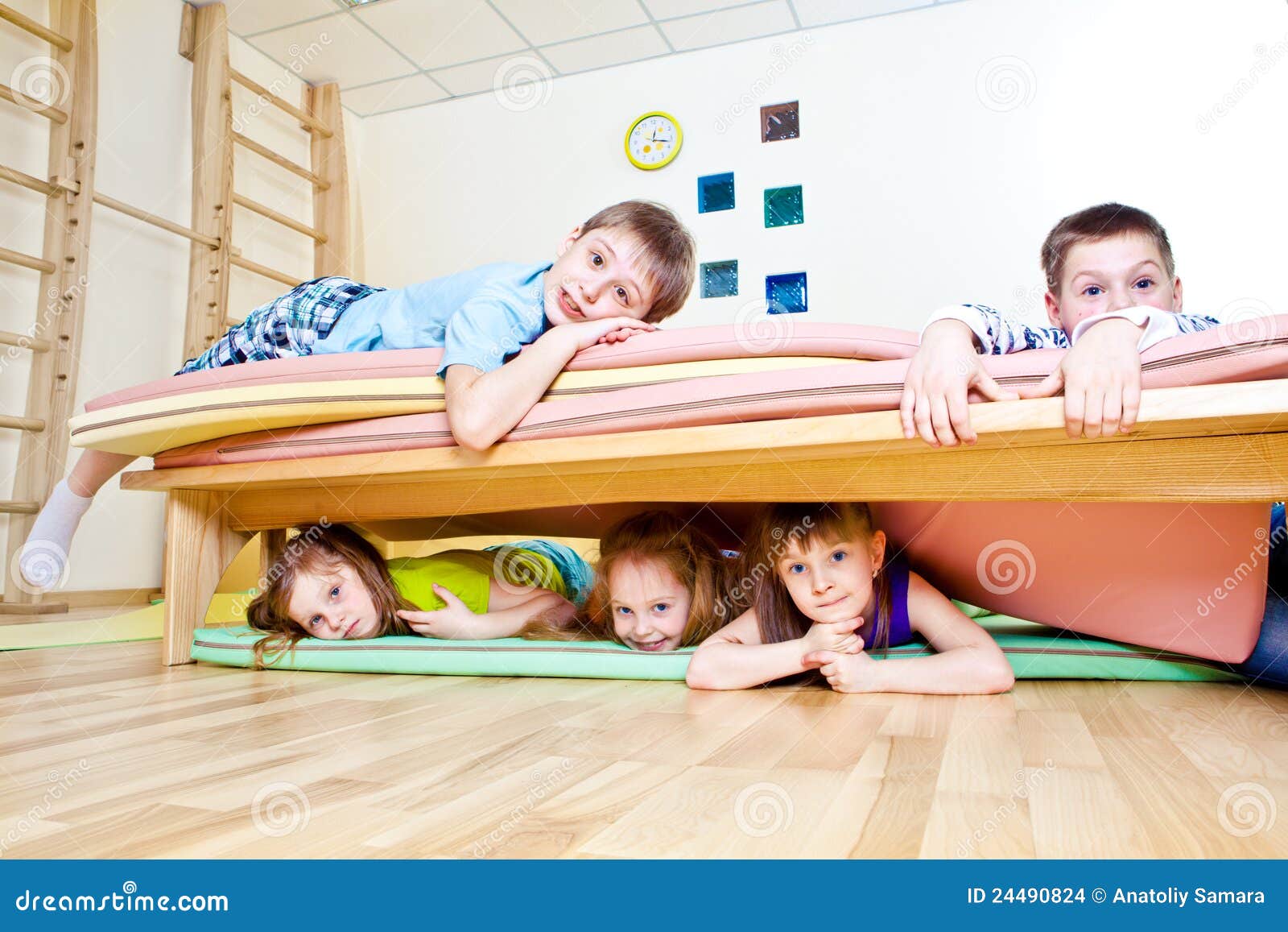 Kids on tumbling mats stock photo. Image of portrait - 24490824