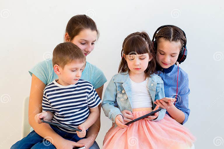 Kids Using Different Gadgets Stock Image - Image of cute, girl: 114618665
