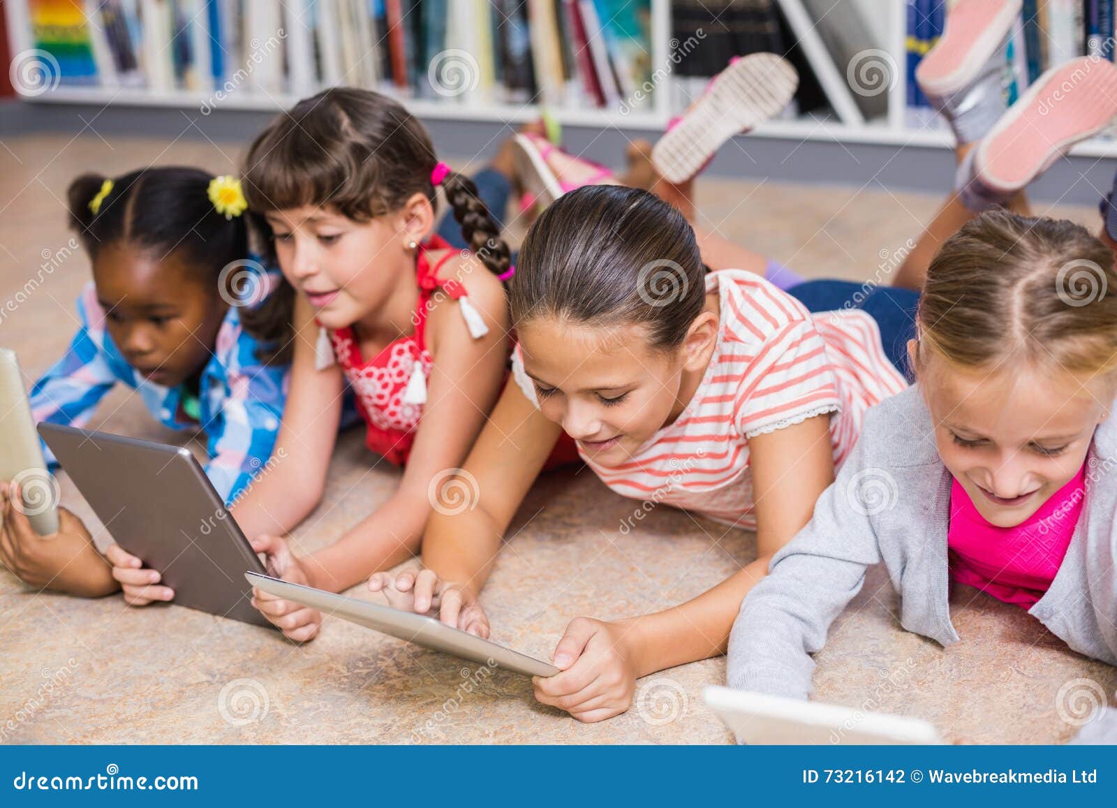 Kids Using Digital Tablet in Library Stock Photo - Image of elementary ...
