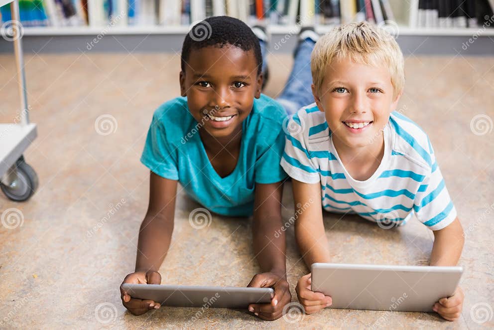 Kids Using Digital Tablet in Library Stock Photo - Image of indoors ...