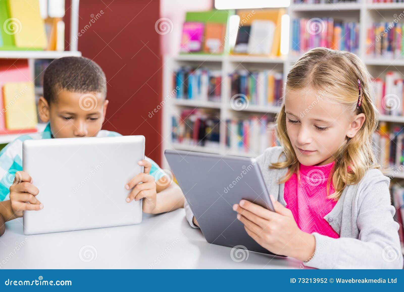 Kids Using Digital Tablet in Library Stock Photo - Image of innocence ...
