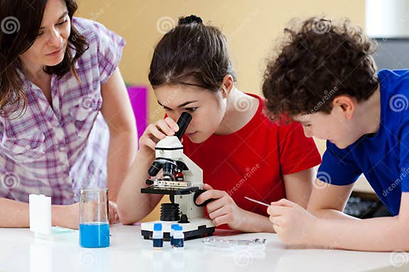 Kids using microscope stock photo. Image of exploring - 19821086