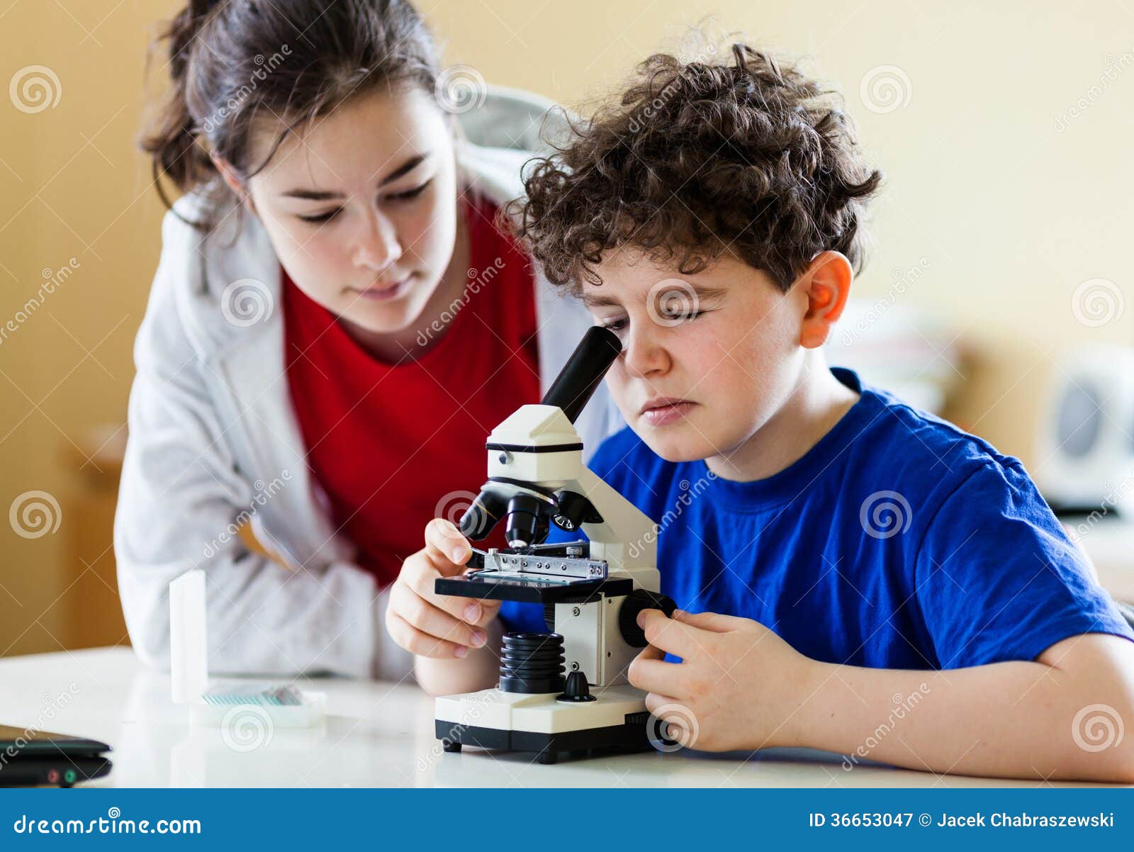 Kids using microscope stock image. Image of chemistry - 36653047