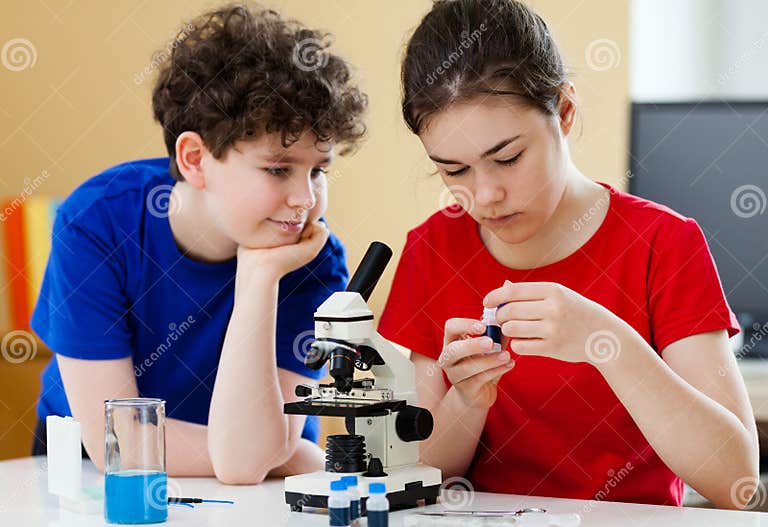 Kids using microscope stock image. Image of horizontal - 36653057