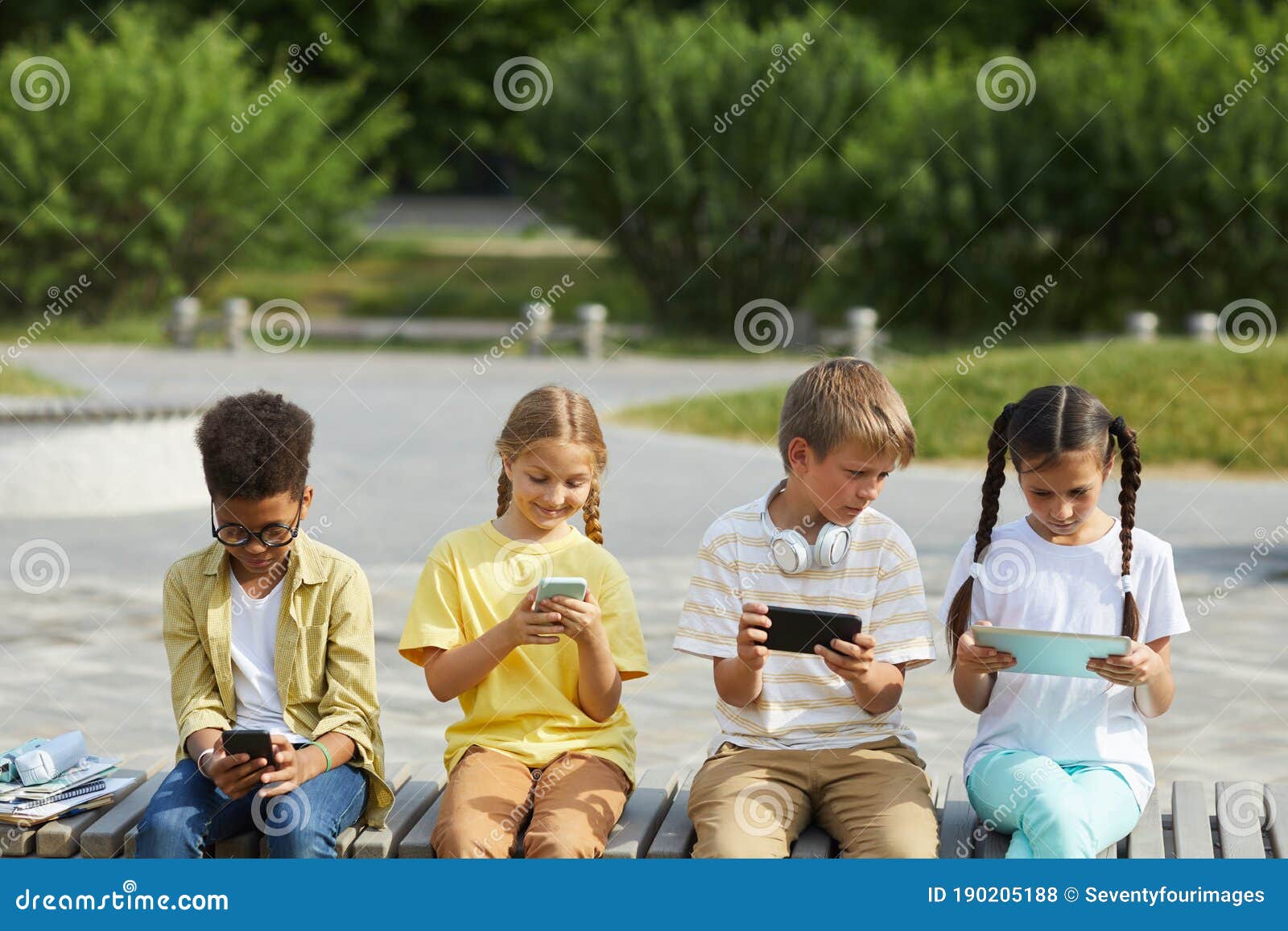 Kids Using Smartphones Outdoors Stock Photo - Image of obsession ...