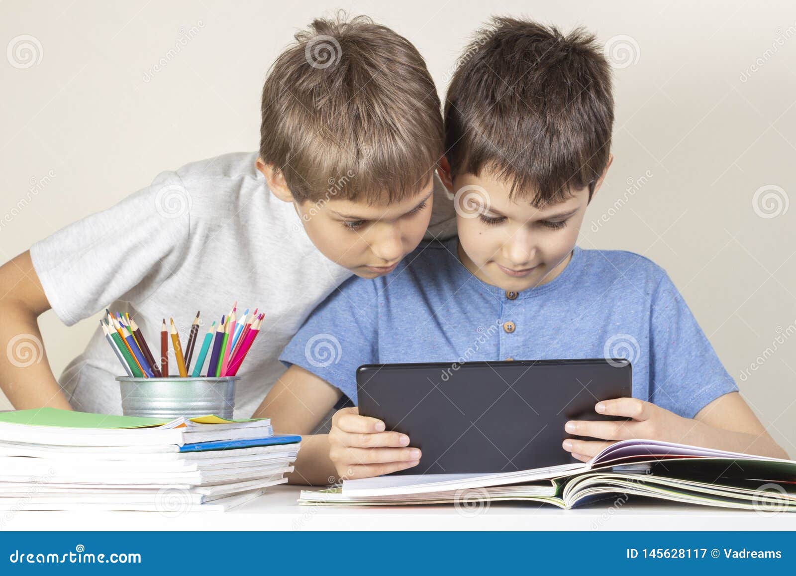 Kids Using Together Tablet Computer at Home Stock Image - Image of book ...