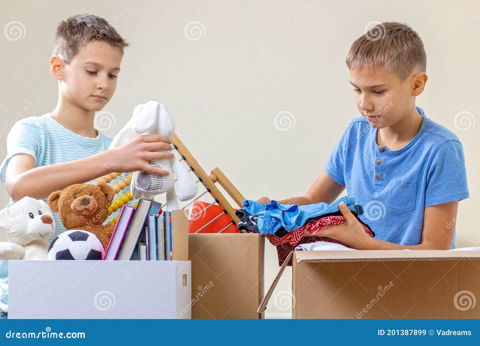 Kids Volunteers Sorting Toys, Clothes, Books, Donation Goods in Donate ... Kids Volunteers Sorting Toys, Clothes, Books, Donation Goods in Donate ...