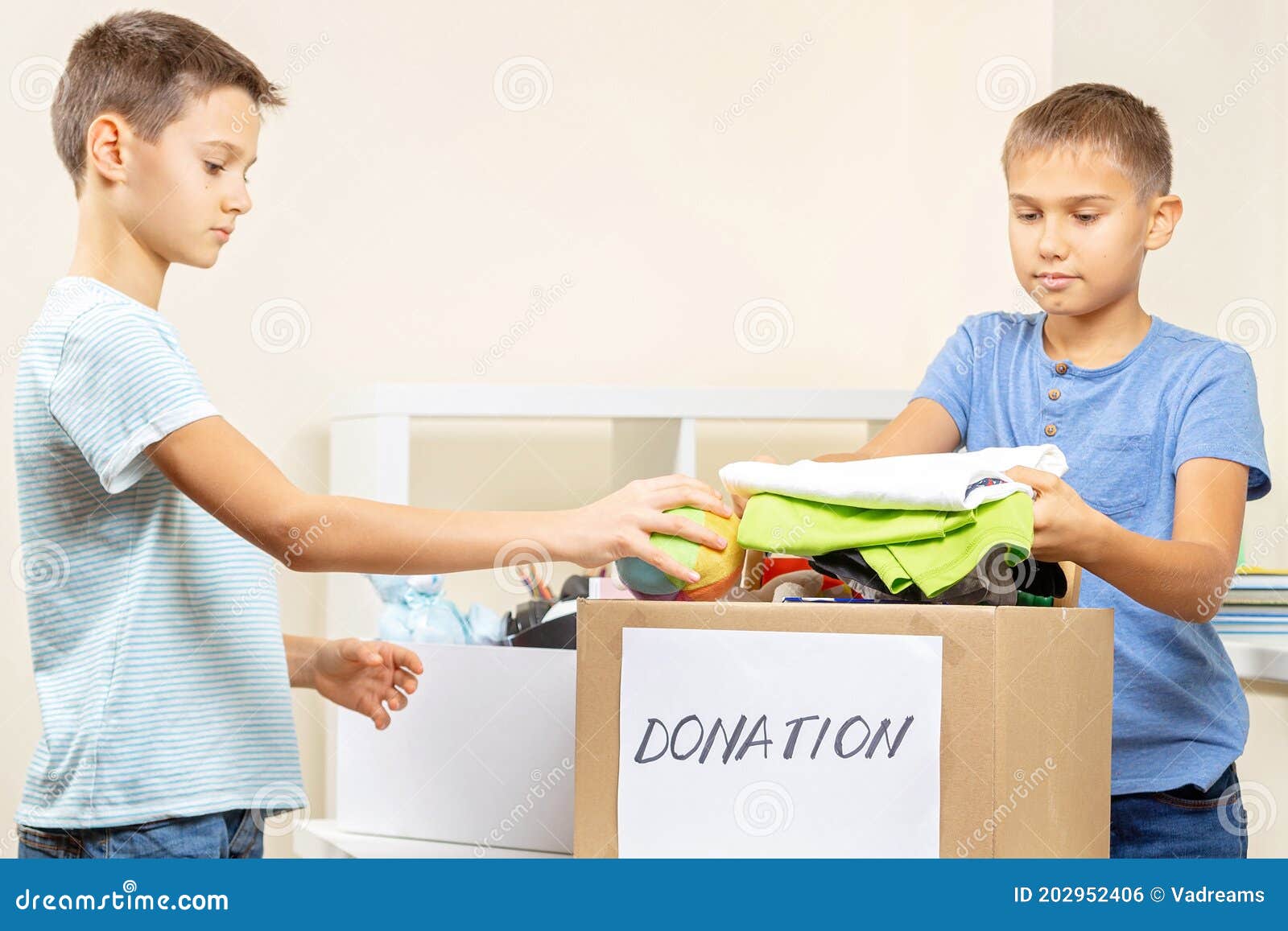 Kids Volunteers Sorting Toys, Clothes, Books, Donation Goods in Donate ... Kids Volunteers Sorting Toys, Clothes, Books, Donation Goods in Donate ...
