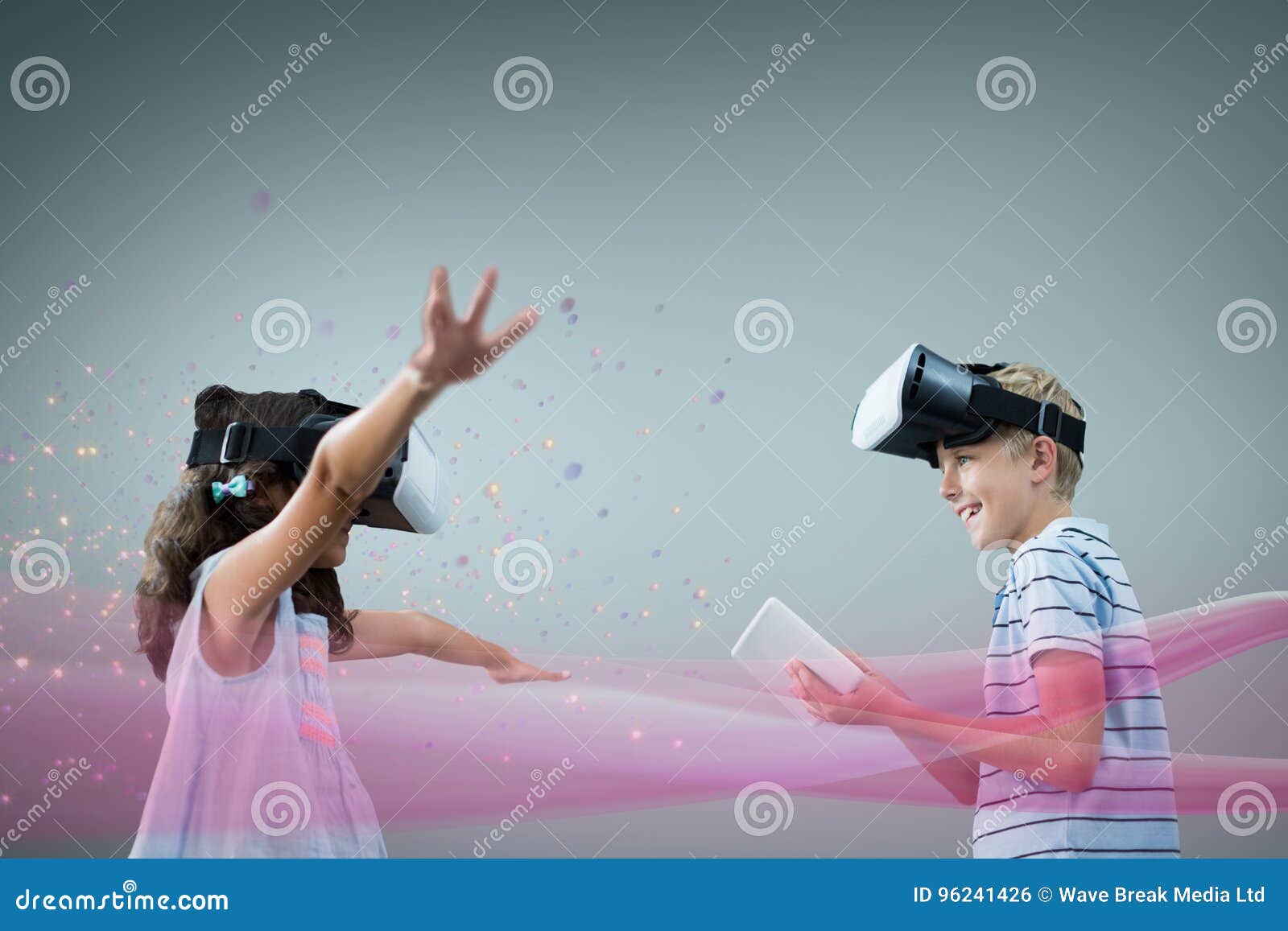 Kids in VR Headset Playing Against Grey Background with Pink Lights ...