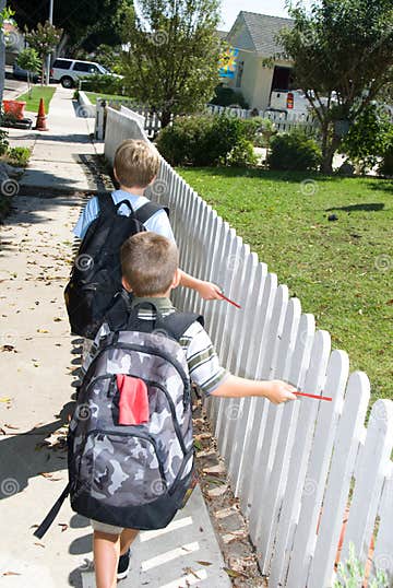 Kids Walking Home from School Stock Photo - Image of fence ...