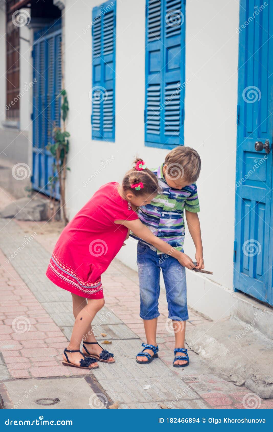 Kids walking by the street stock photo. Image of children - 182466894