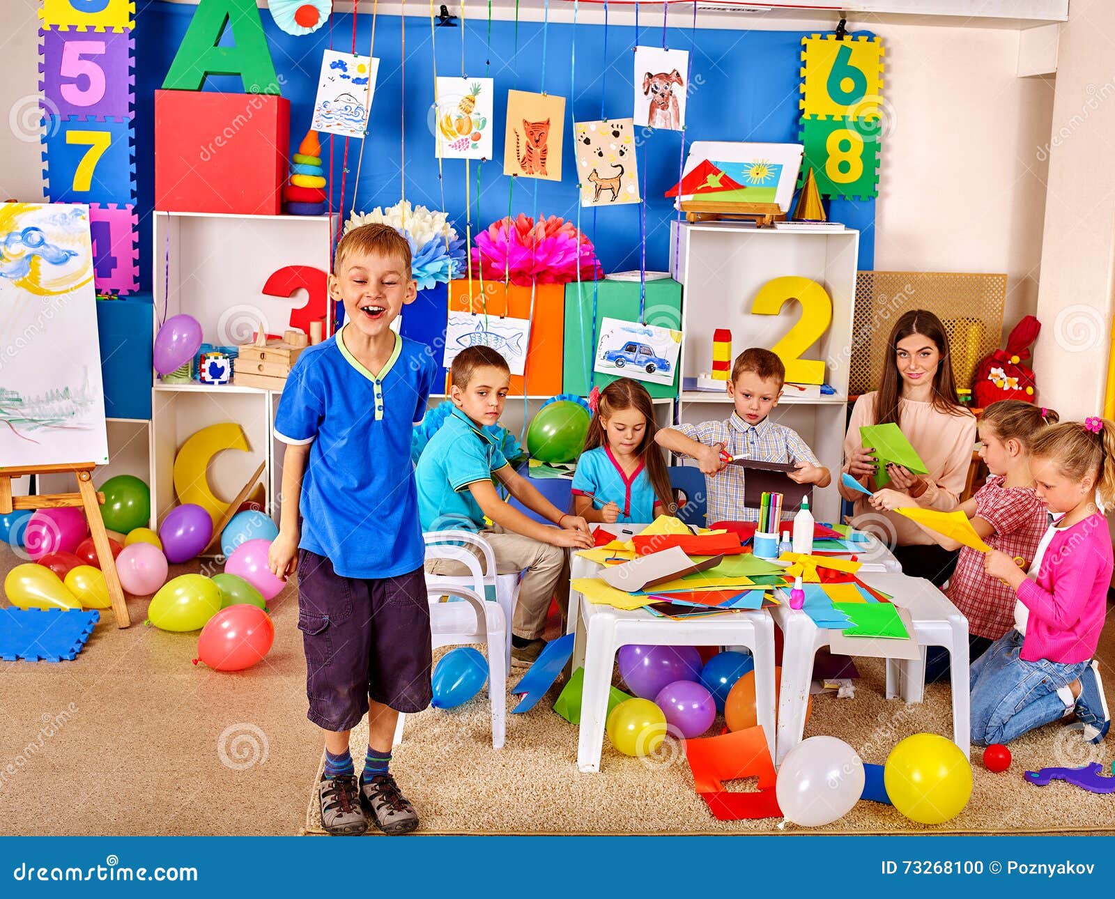 Kids Working with Colored Paper on Table in Kindergarten . Stock Photo ...