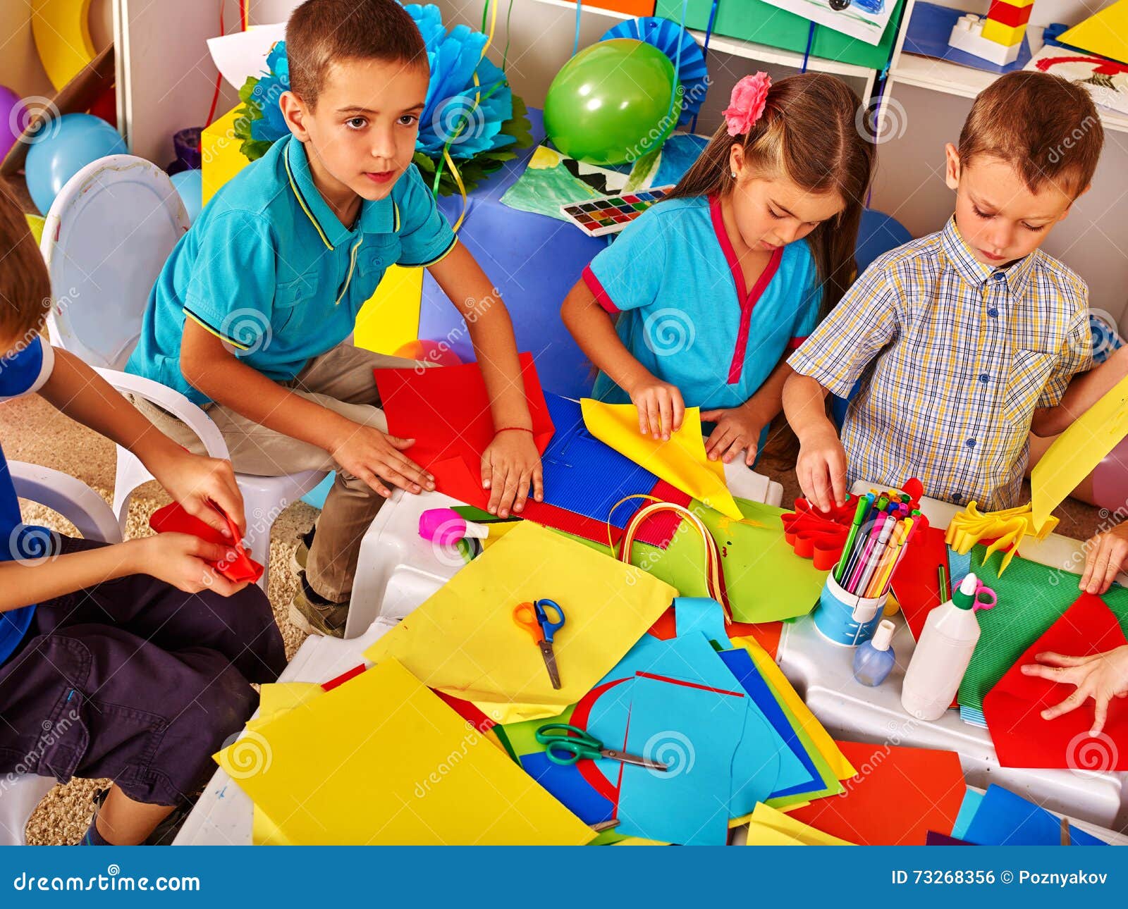 Kids Working with Paper on Table in Kindergarten . Stock Photo - Image ...