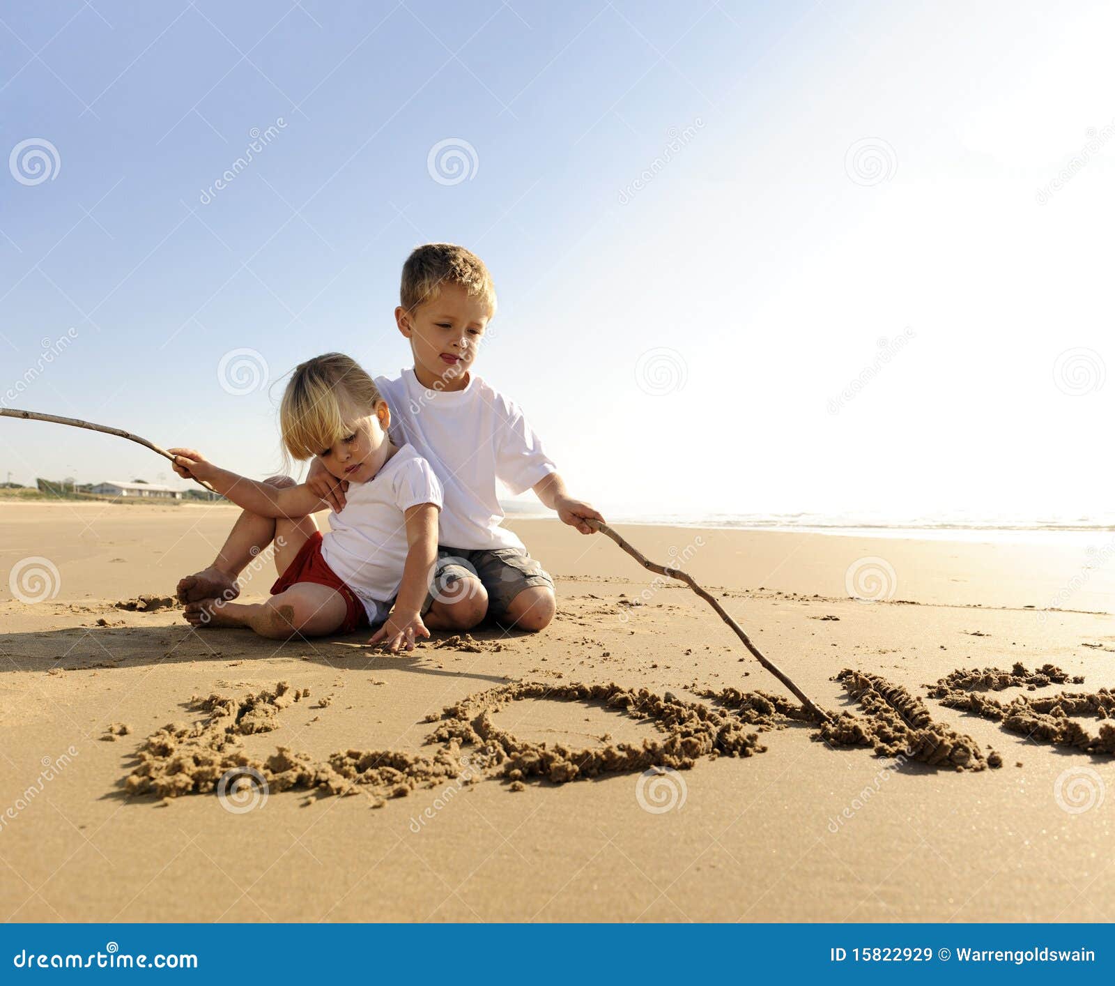 Kids writing in sand stock image. Image of coast, sister - 15822929