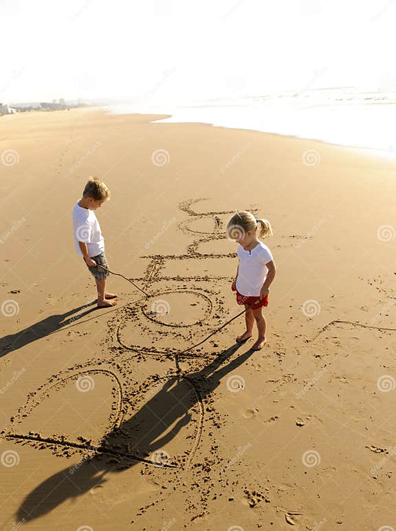 Kids writing in sand stock image. Image of sister, caucasian - 15822943