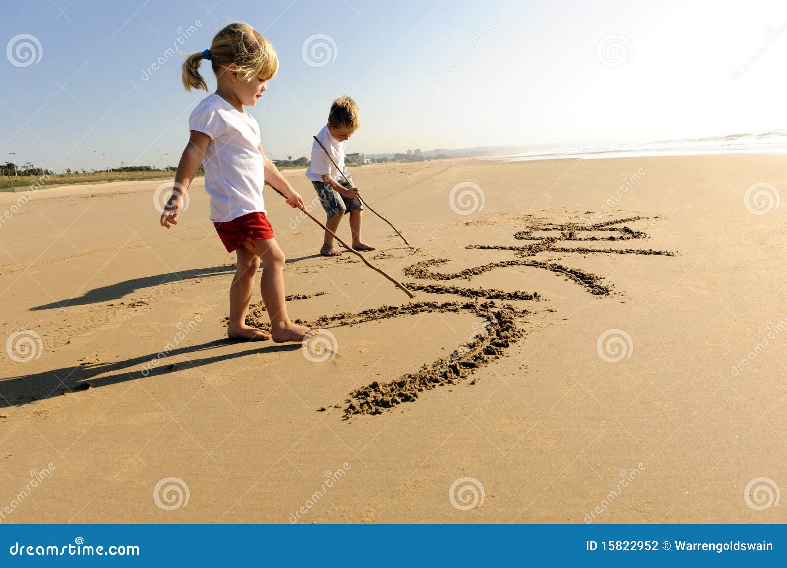 Kids writing in sand stock photo. Image of brother, happiness - 15822952