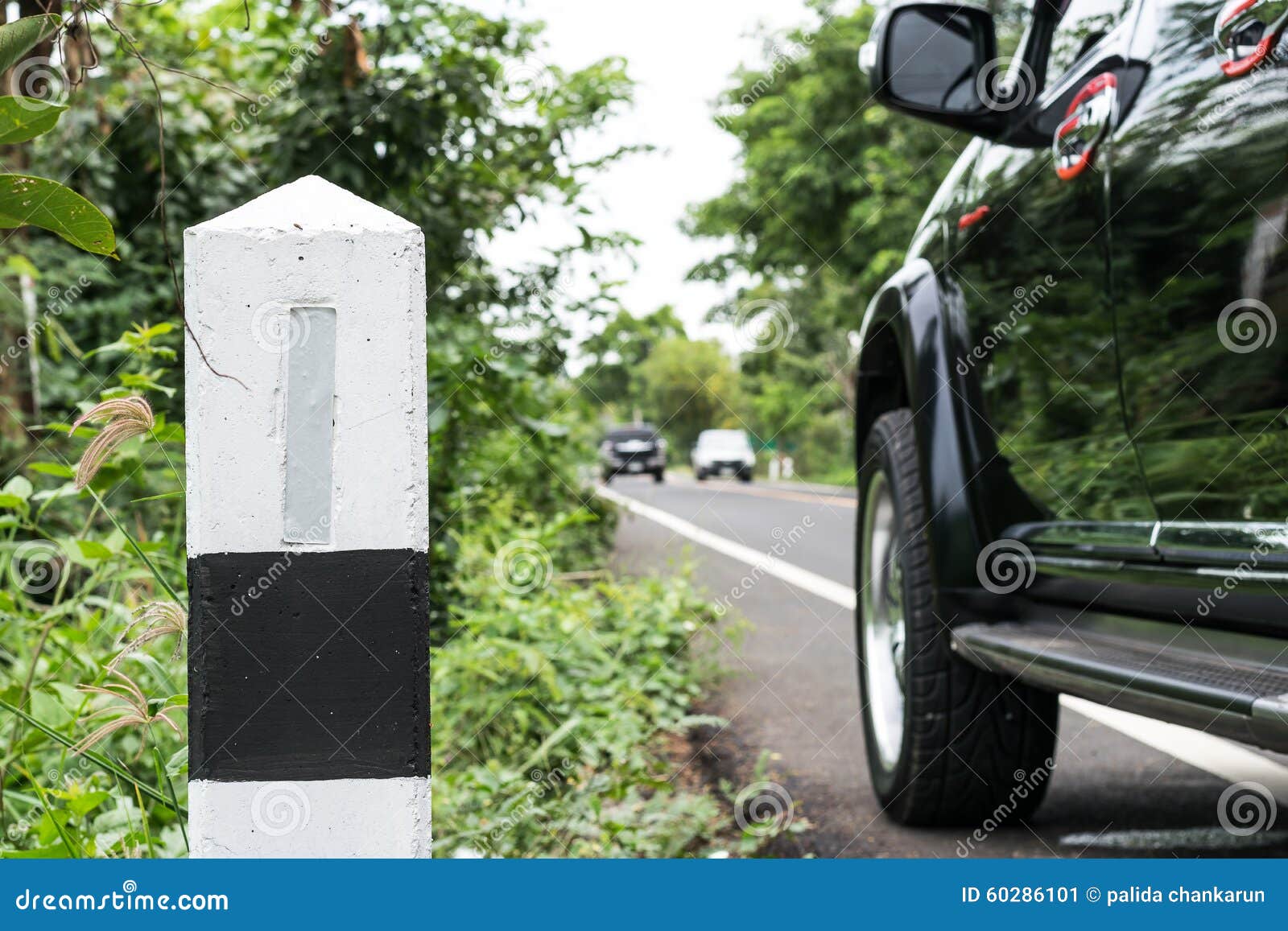 A Kilometer Stone on the Country Road with the Car Background. Stock ...