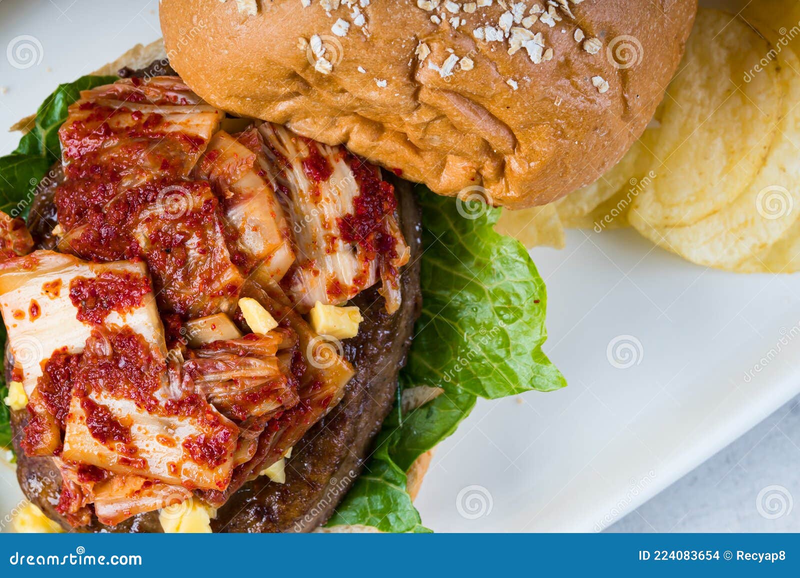 Kimchi Angus Beef Burger with Potato Chips on the Side Stock Photo ...