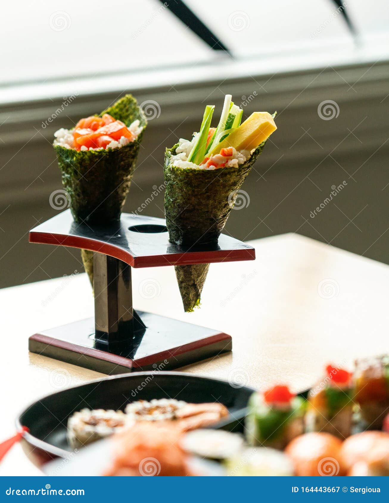 A Kind of Japanese Sushi in a Cone on a Stand. Stock Image - Image of ...