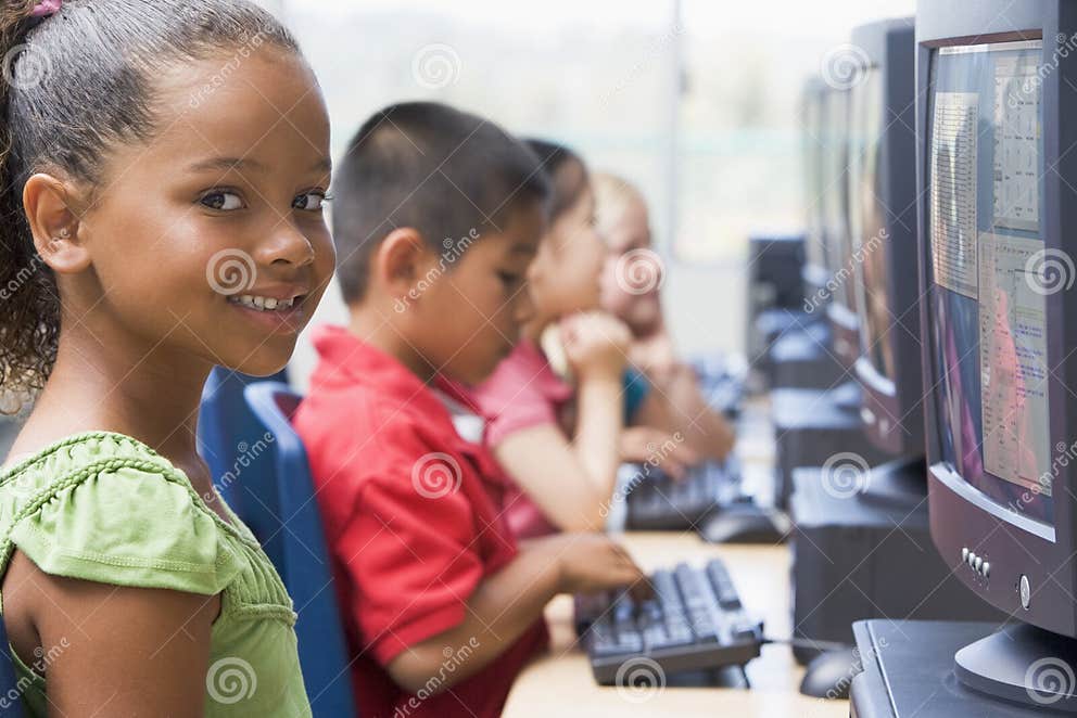 Kindergarten Children Learning To Use Computers. Stock Image - Image of ...