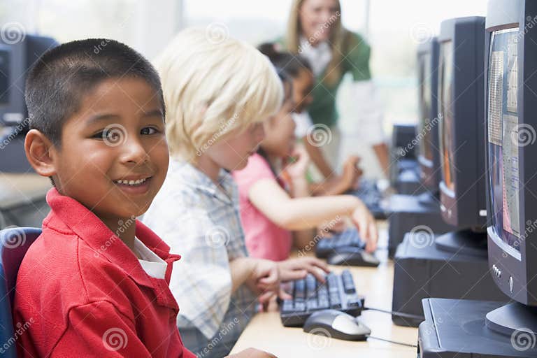 Kindergarten Children Learning To Use Computers Stock Photo - Image of ...