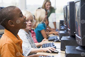 Kindergarten Children Learning To Use Computers Stock Photo - Image of ...