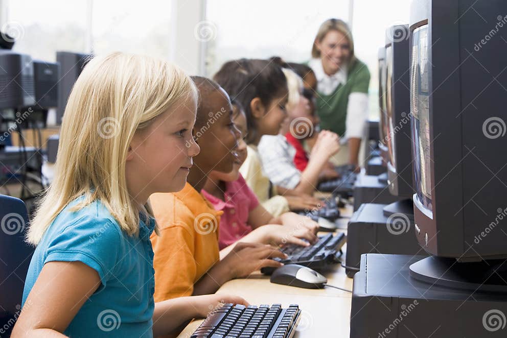 Kindergarten Children Learning To Use Computers Stock Photo - Image of ...