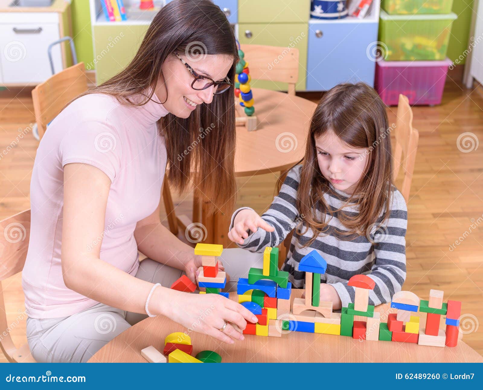 Kindergarten Teacher Playing with Child Stock Photo - Image of game ...
