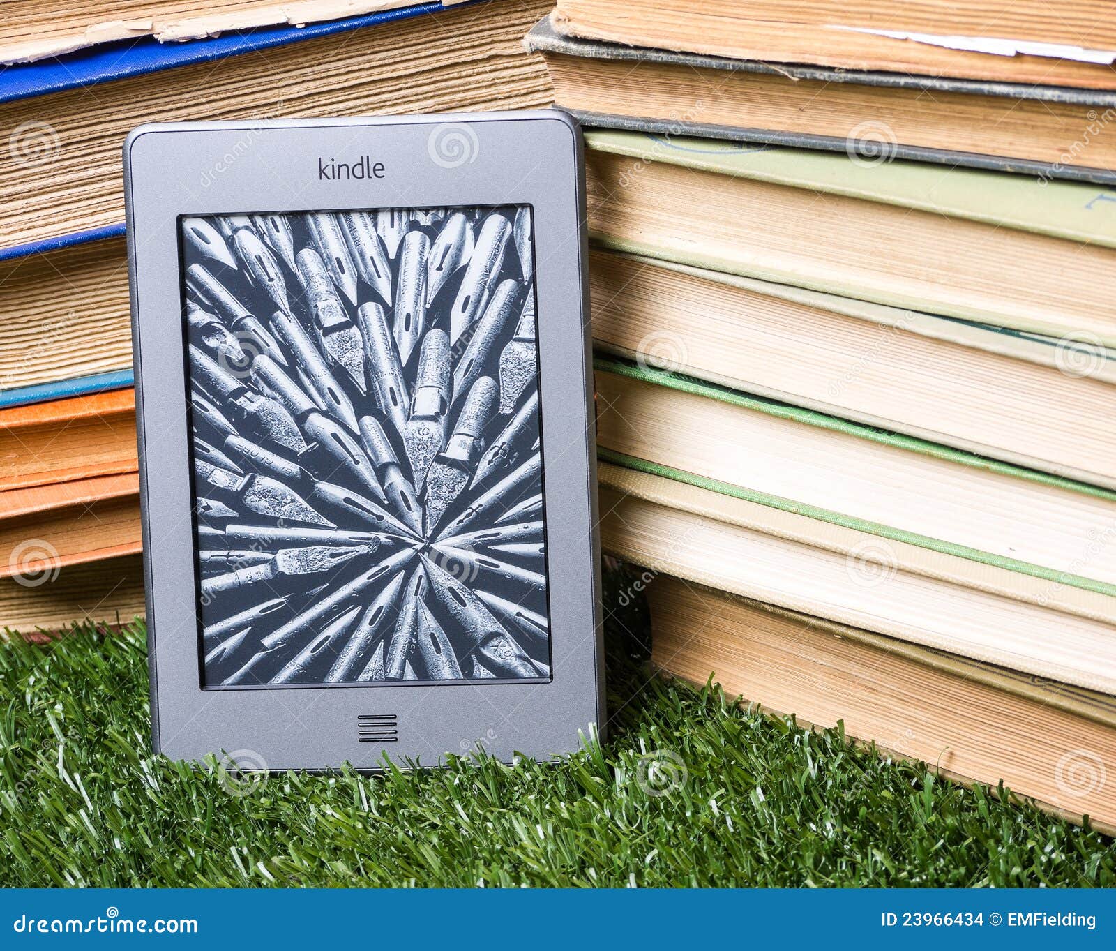 Kindle Touch E-Reader Next To Stack of Books Editorial Stock Image ...