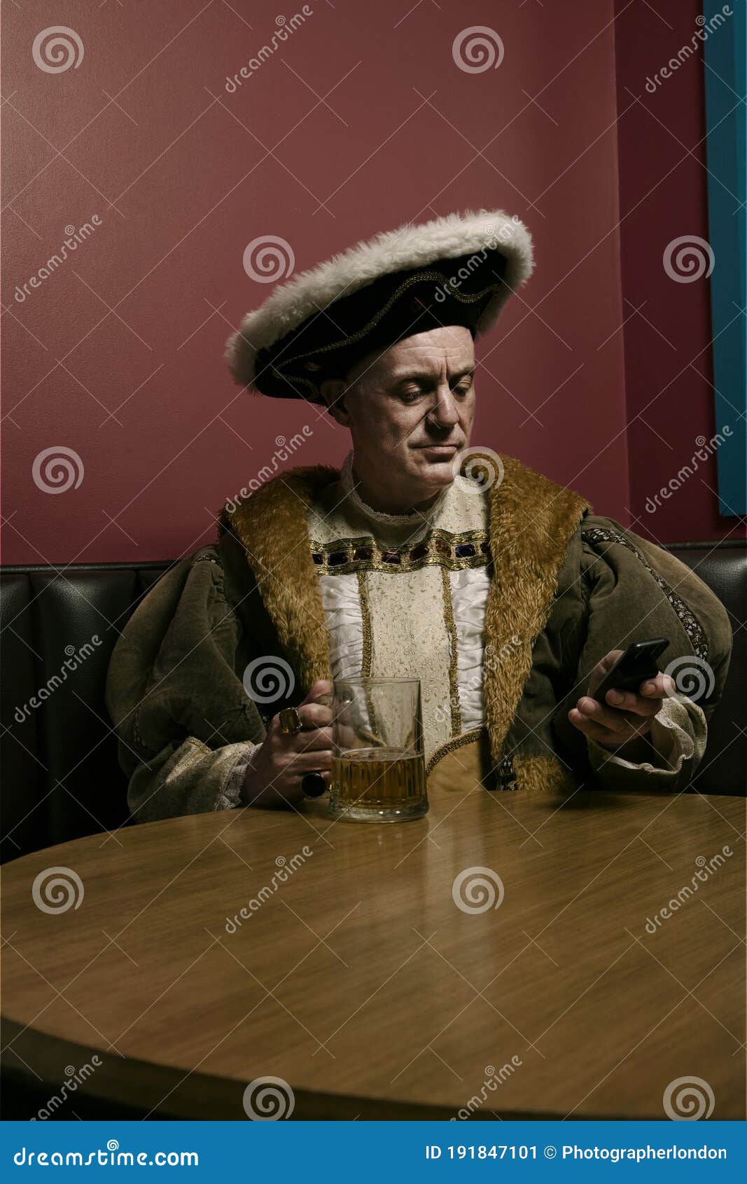 King Henry VIII Using Mobile Phone at Table Stock Image - Image of ...